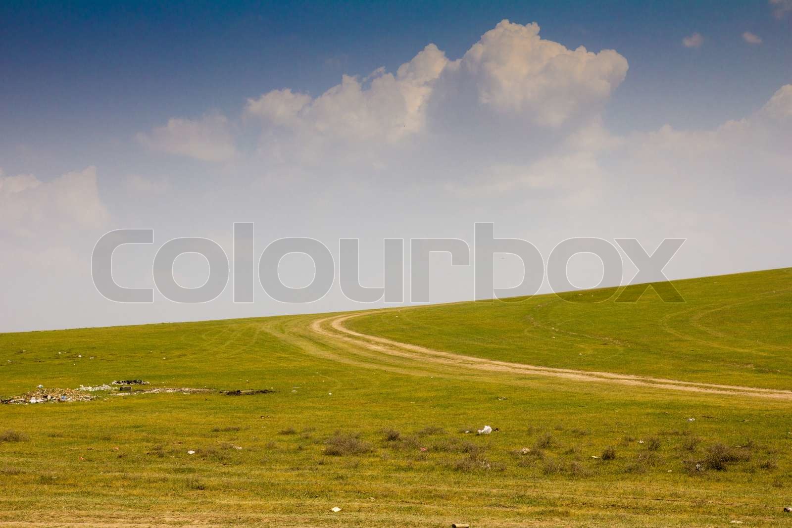 green field with a road | Stock image | Colourbox