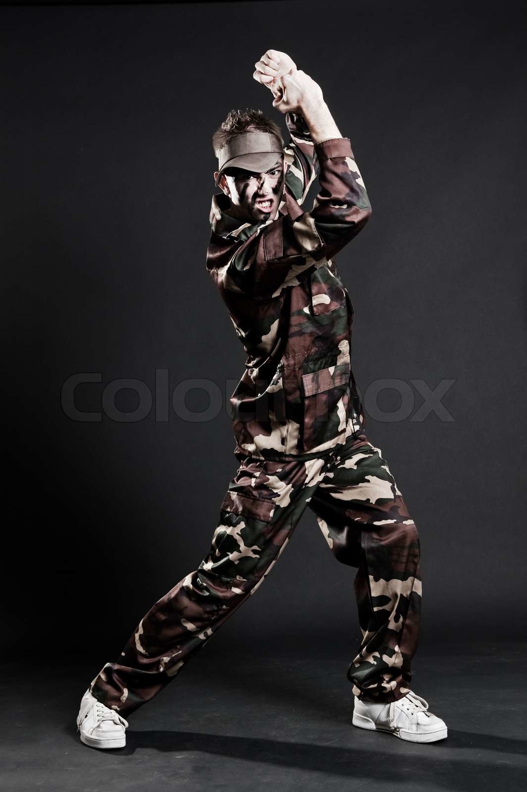 aggressive soldier in military uniform | Stock image | Colourbox