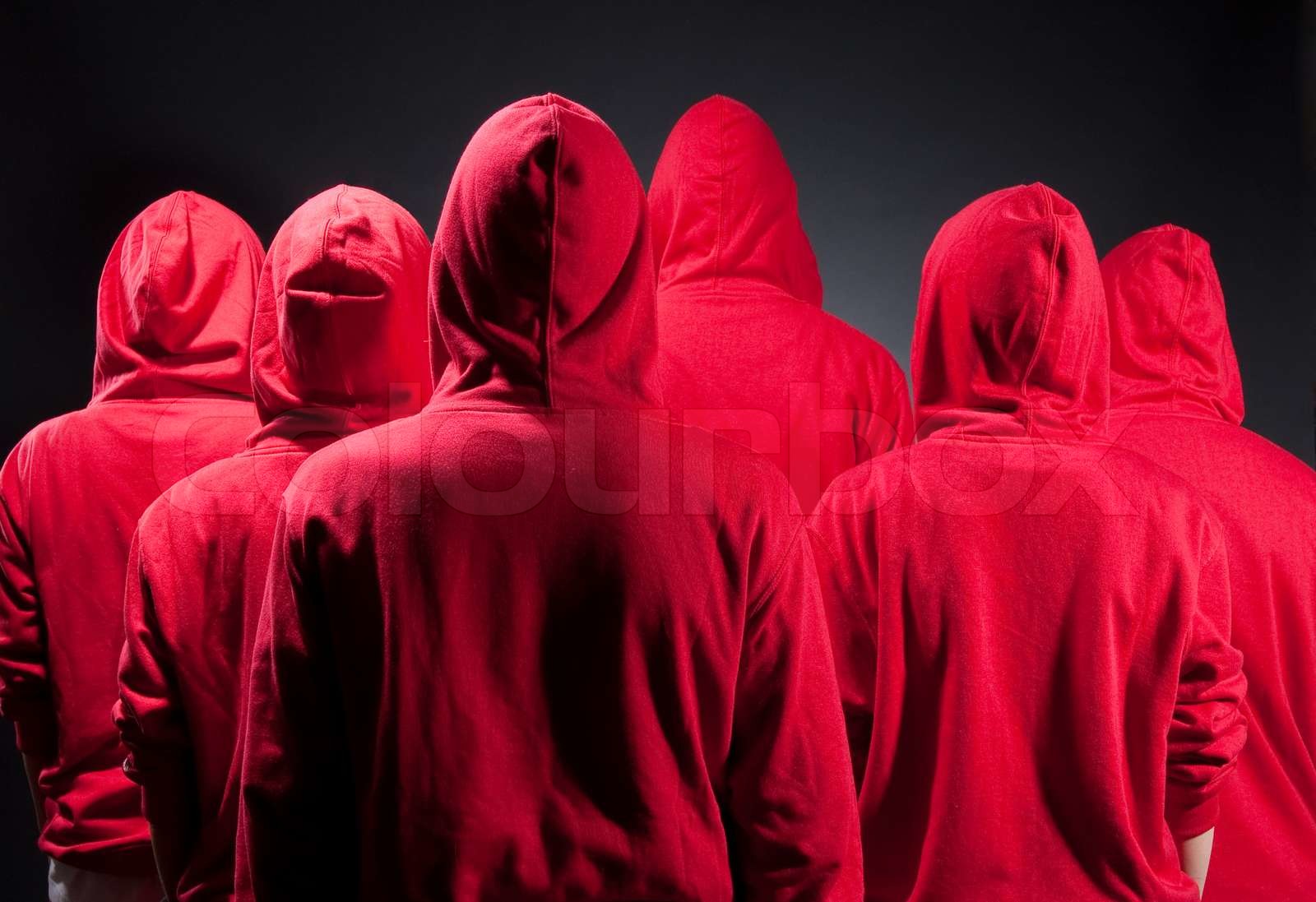 backs of people in red clothes | Stock image | Colourbox