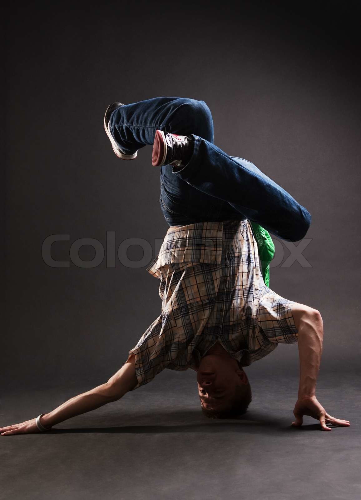 breakdancer standing in complicated pose | Stock image | Colourbox