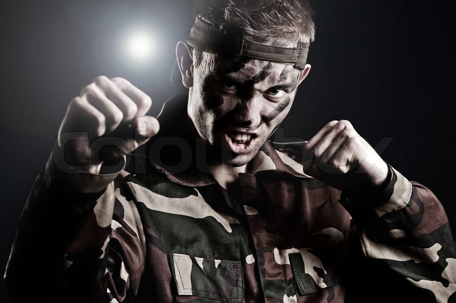 expressive military man assaulting | Stock image | Colourbox