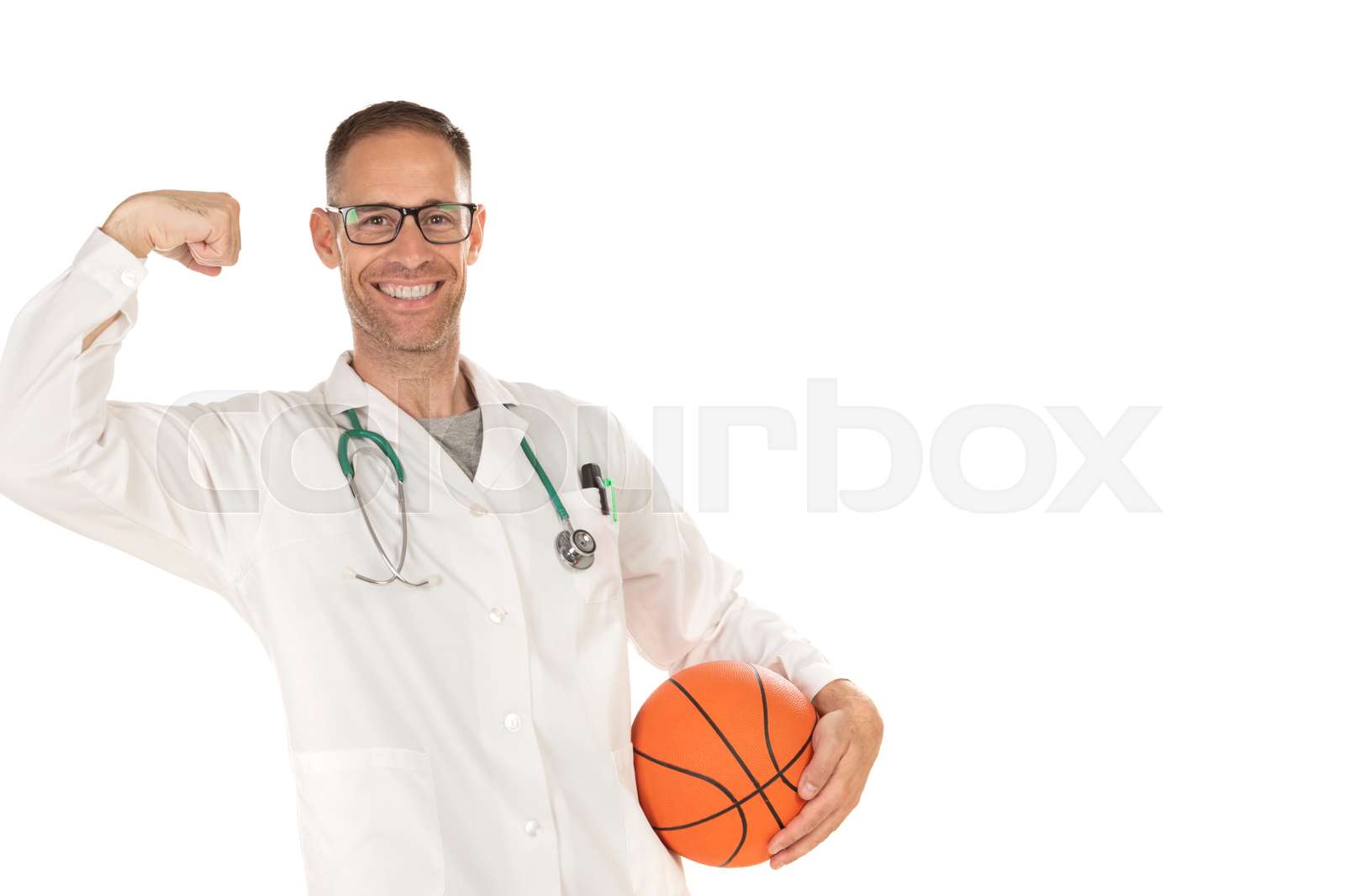 Handsome doctor with a basketball ball | Stock image | Colourbox
