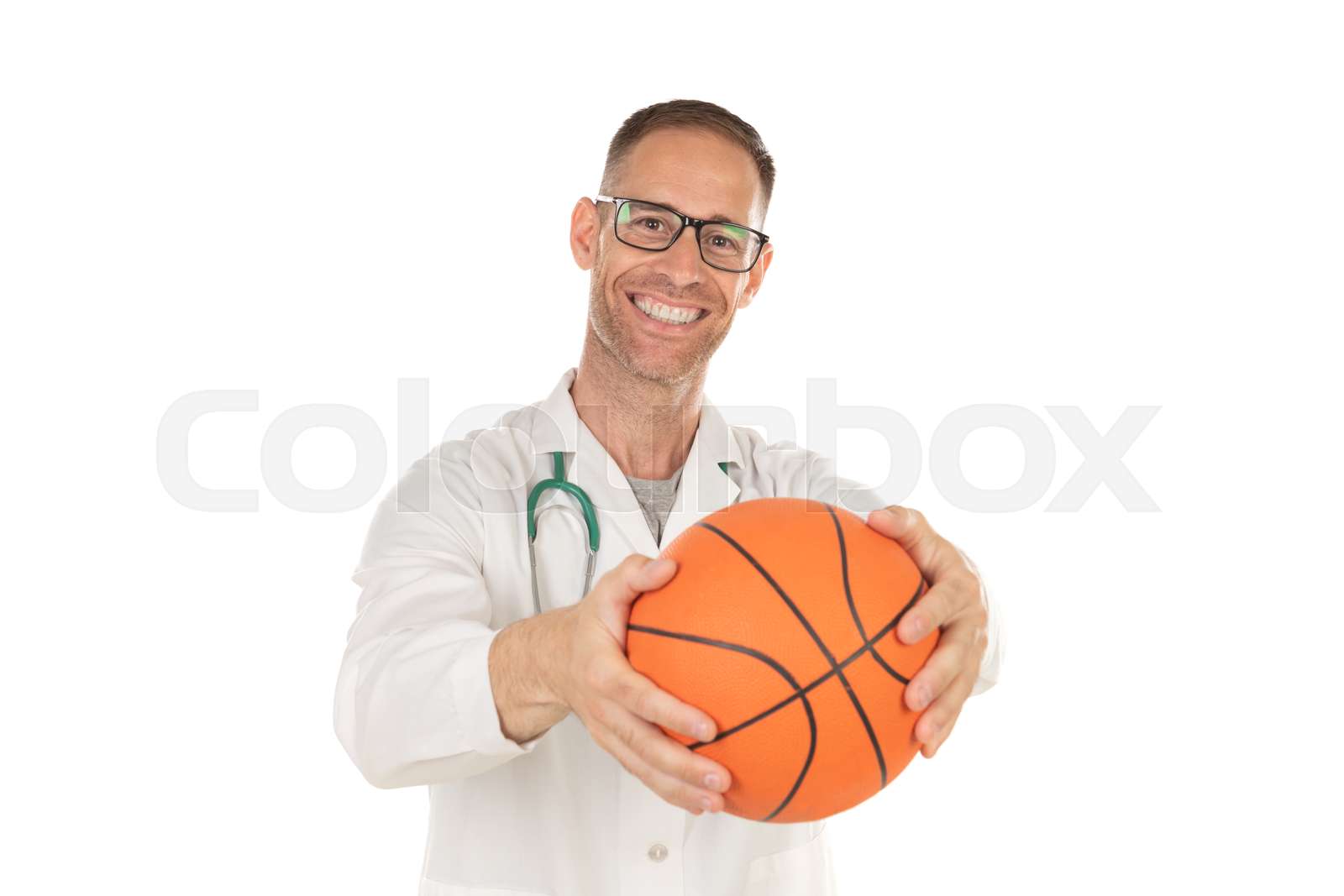 Handsome doctor with a basketball ball | Stock image | Colourbox