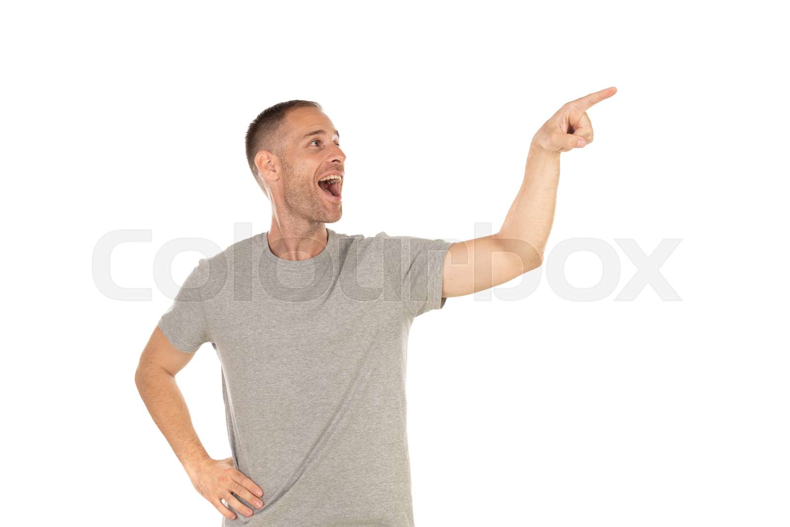 Handsome guy pointing something with his hands | Stock image | Colourbox