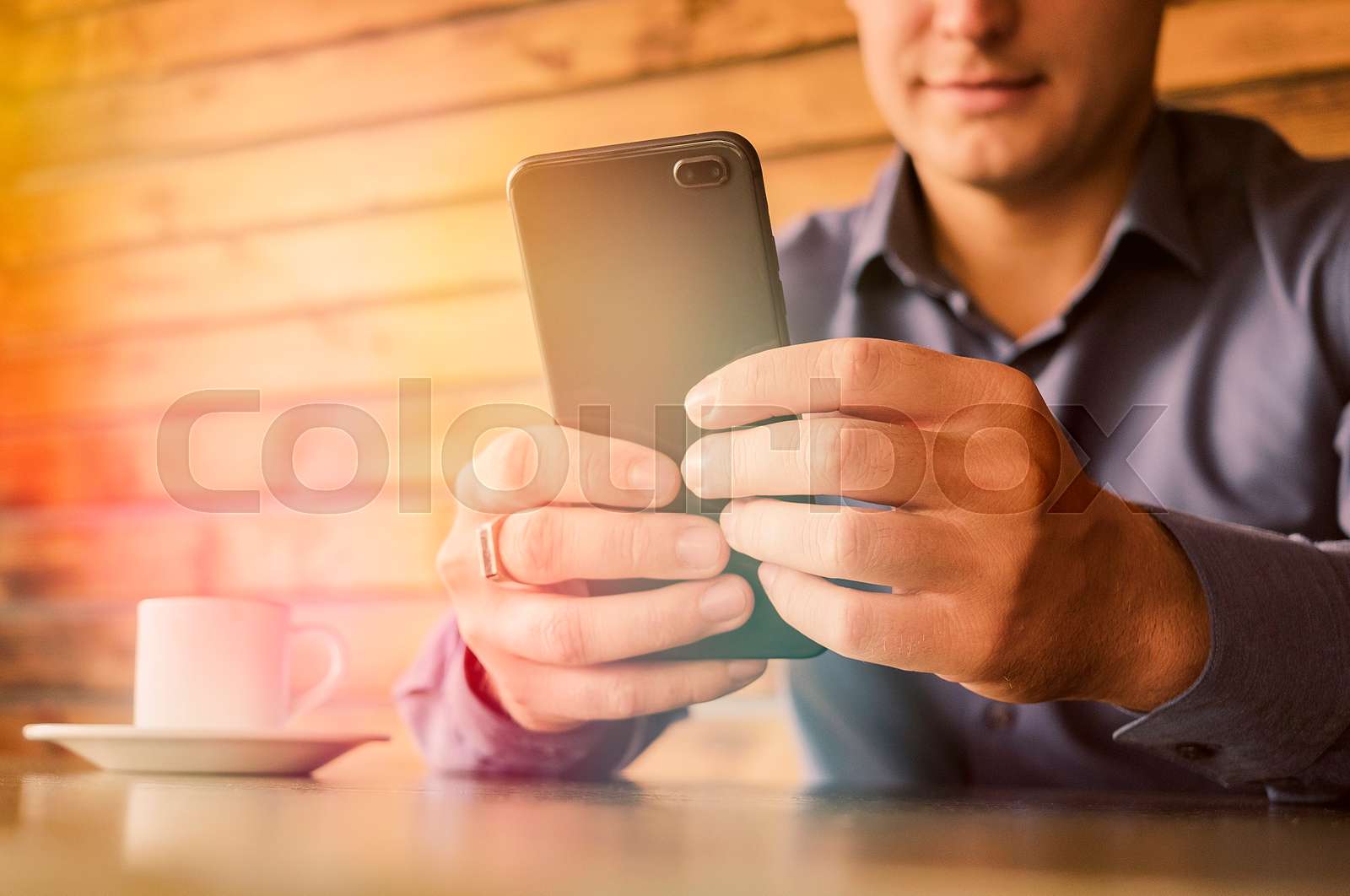 Businessman using a mobile phone in the office | Stock image | Colourbox