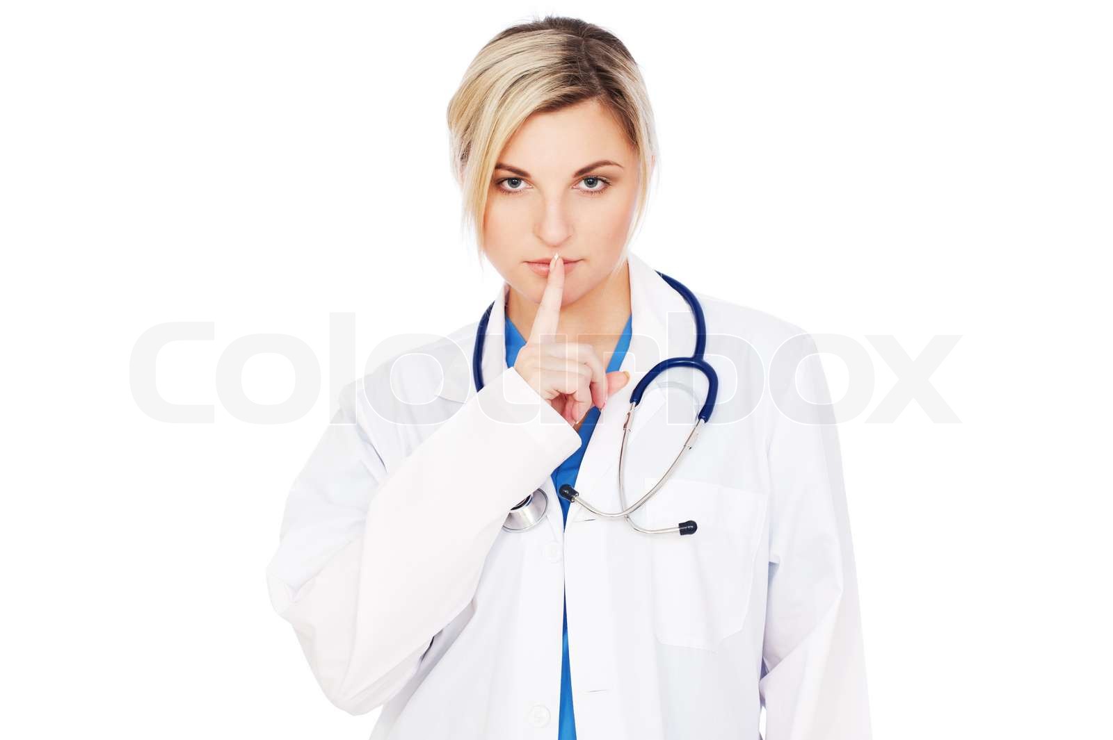 serious doctor making silence sign | Stock image | Colourbox