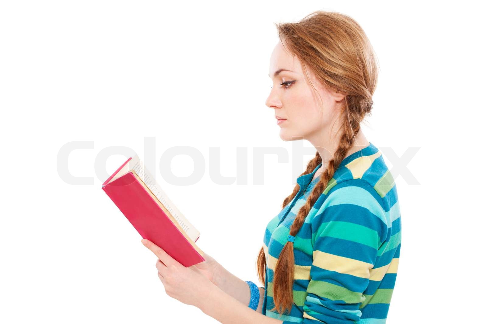 sideview portrait of reading student | Stock image | Colourbox