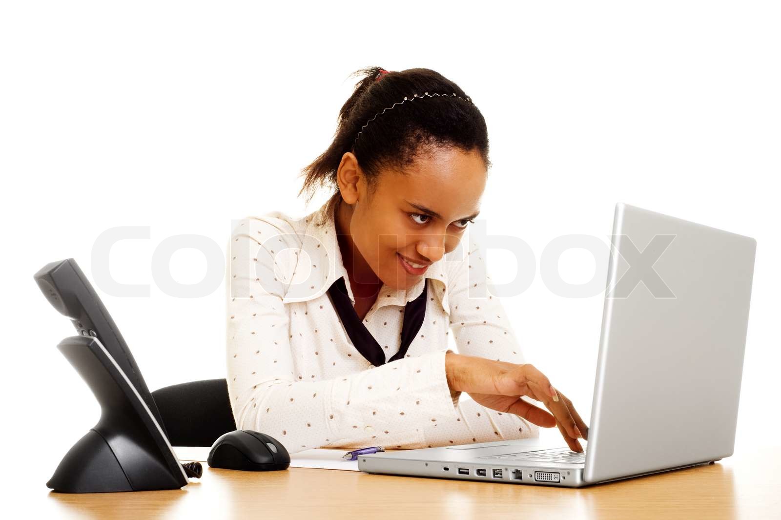 smiley business woman typing on computer | Stock image | Colourbox