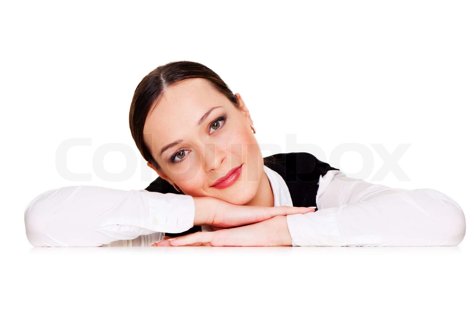 Smiley freundlich Frau liegend auf Exemplar | Stock Bild | Colourbox