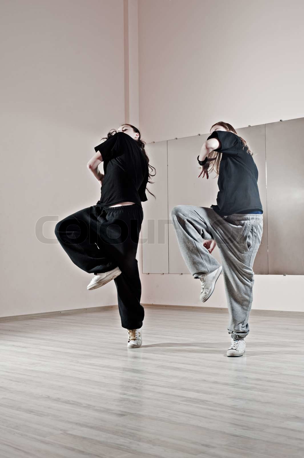 two girls dancing synchronously | Stock image | Colourbox