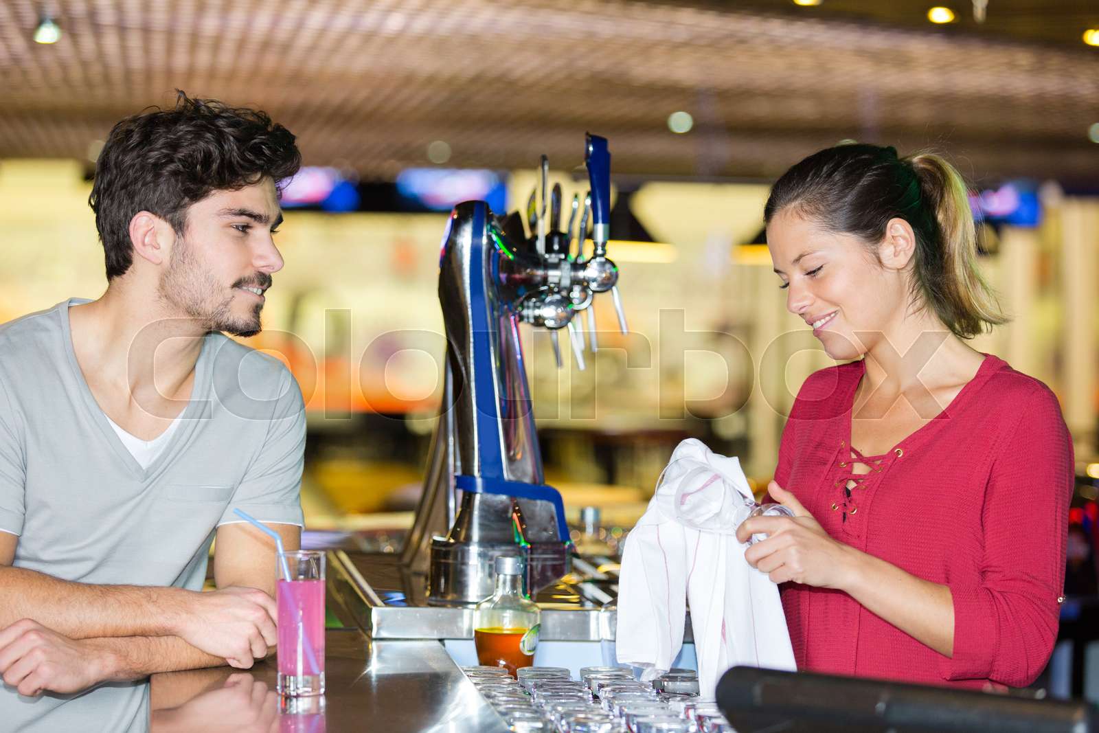customer flirting with cheerful pretty female bartender | Stock image ...