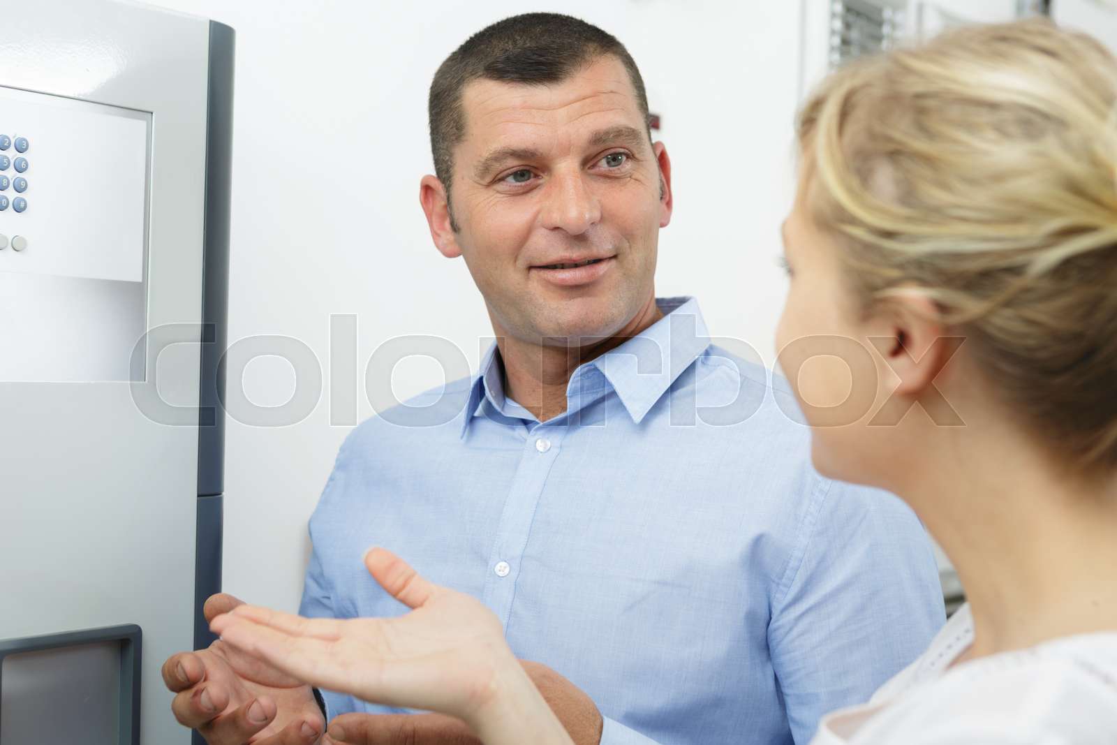 two workers having a conversation | Stock image | Colourbox