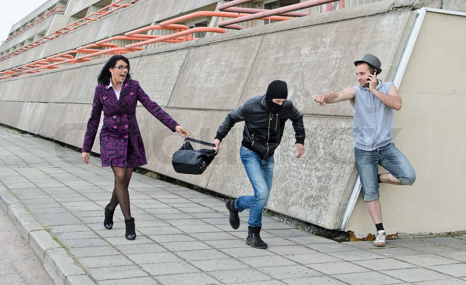 Robbery prevention on the street Thief try to steal a bag | Stock image ...
