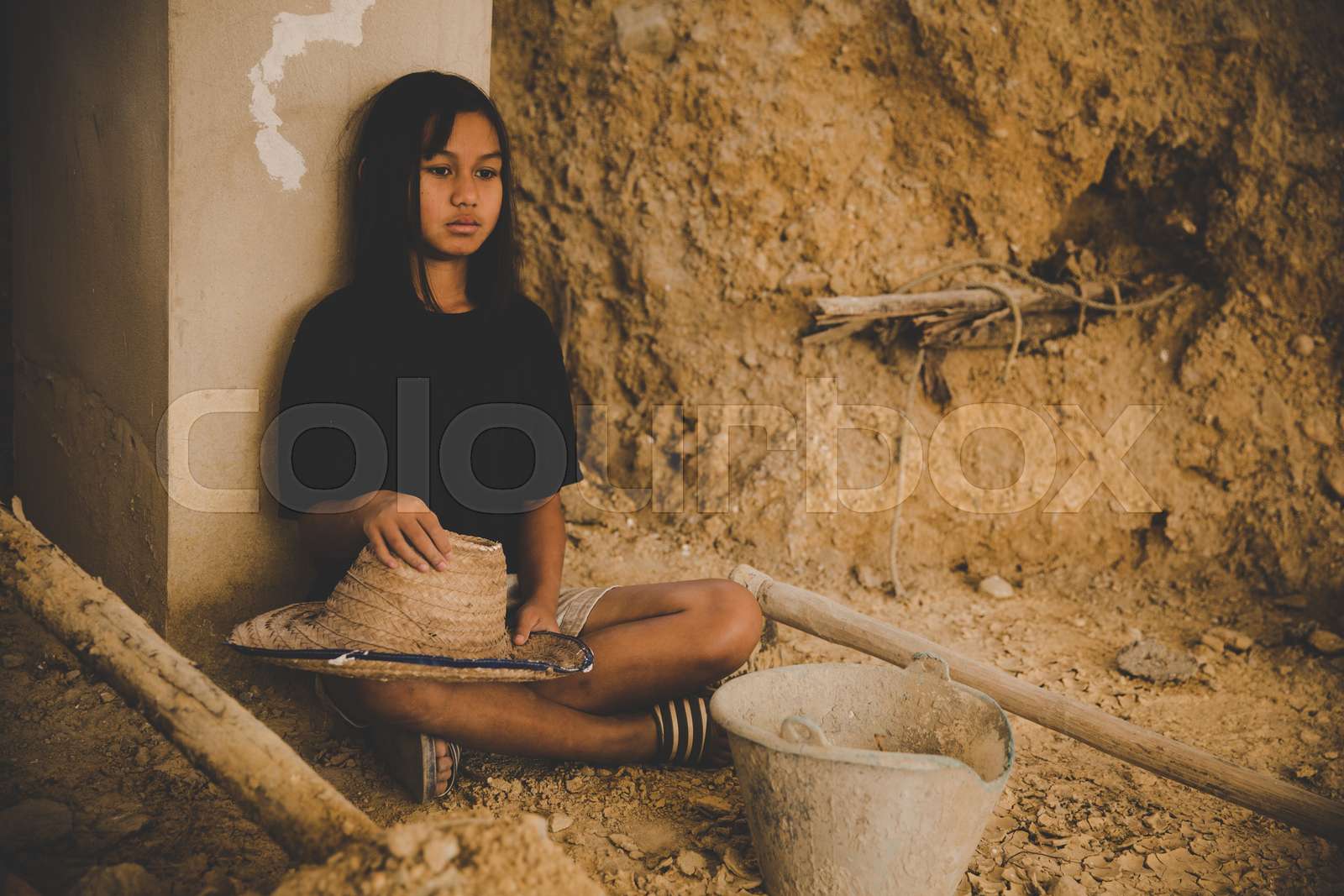 Little girl labor working in commercial building structure, World Day ...