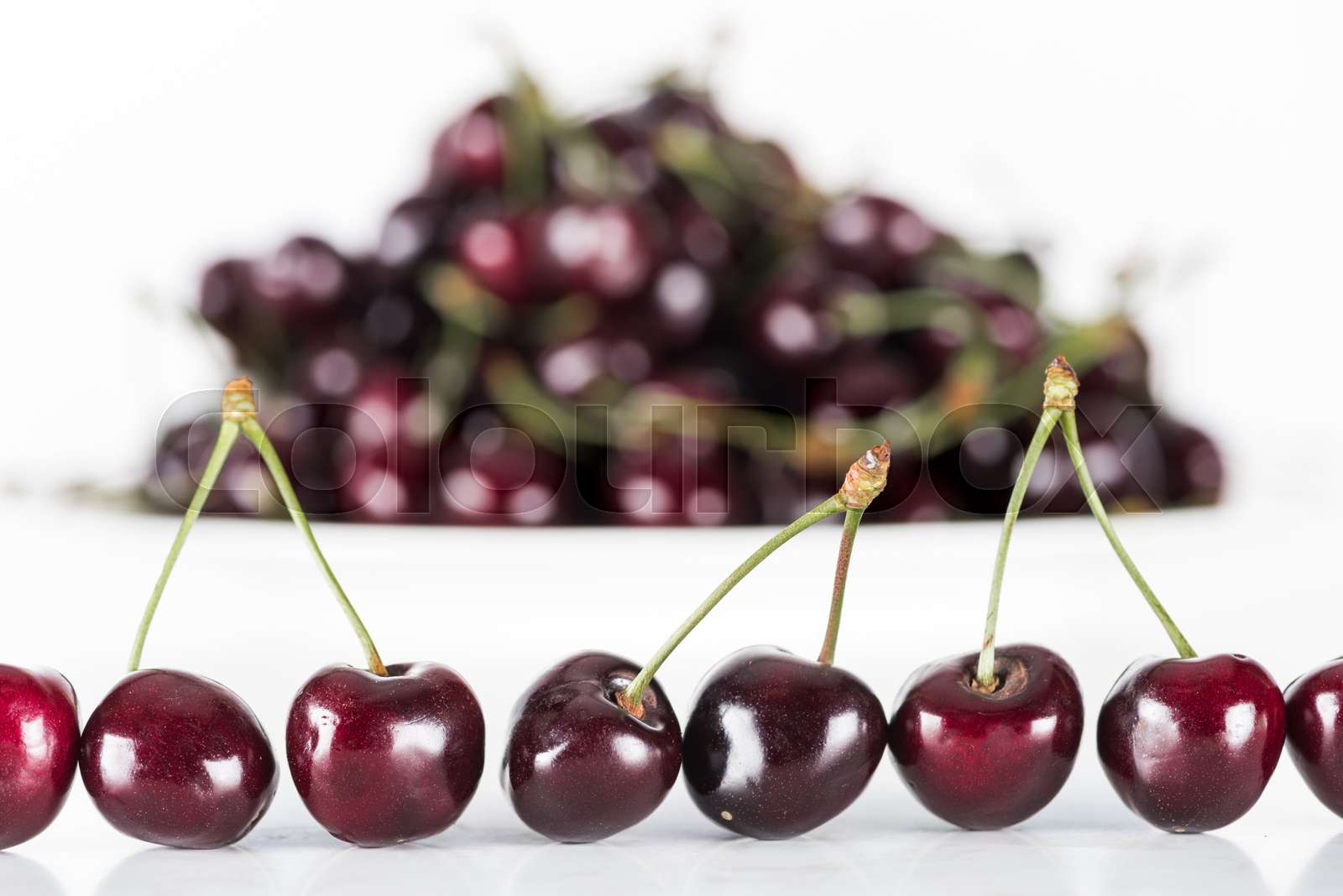 selective focus of red, fresh, whole and sweet cherries | Stock image ...