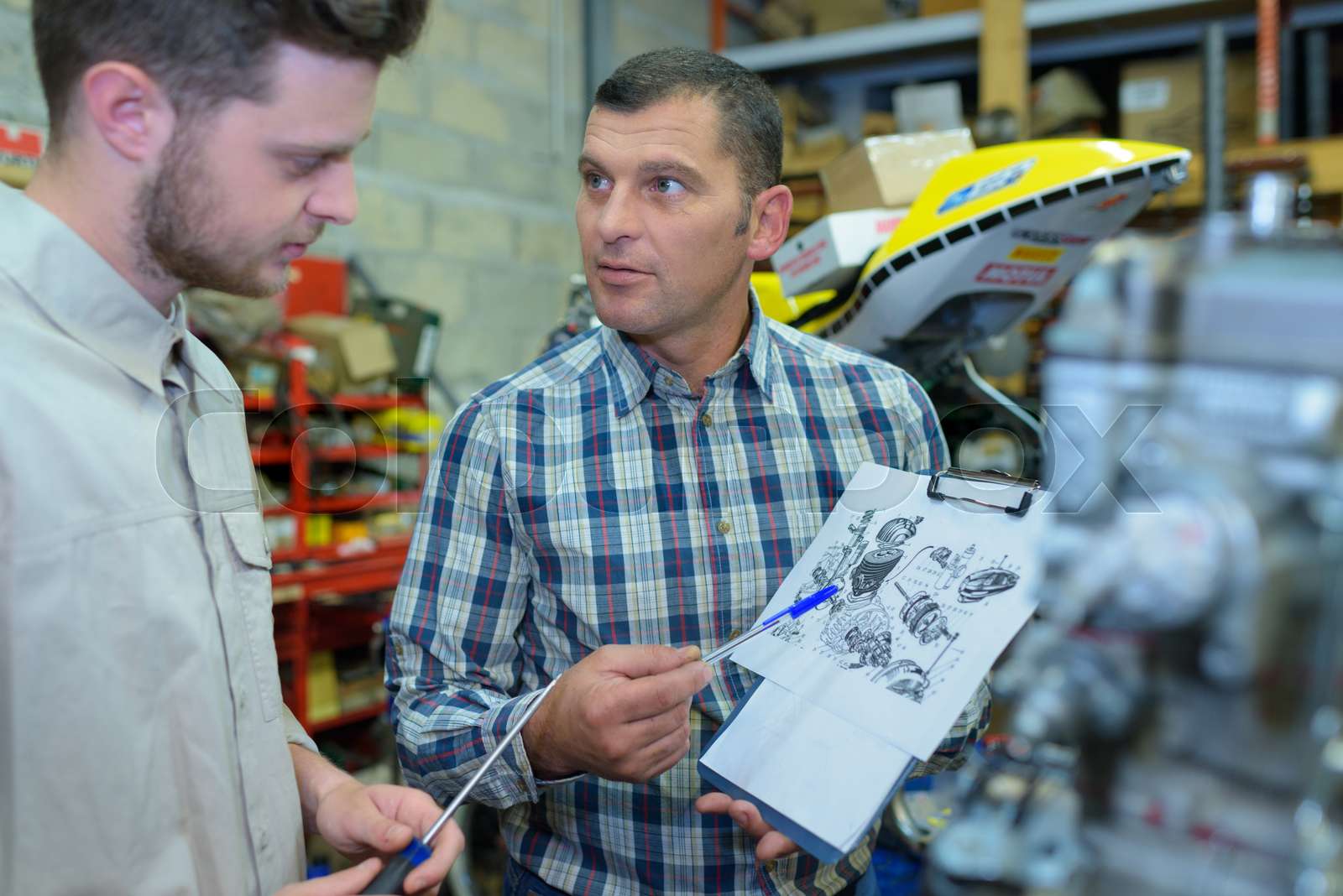 portrait of mechanical engineering checking drawing | Stock image ...