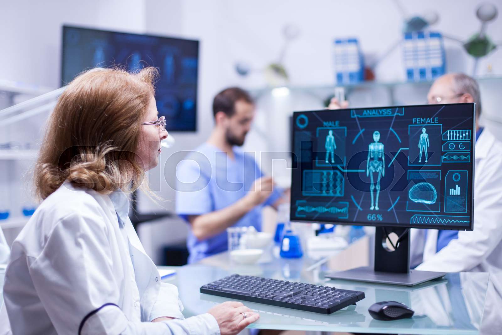Female scientist looking at the monitor screen in research room | Stock ...