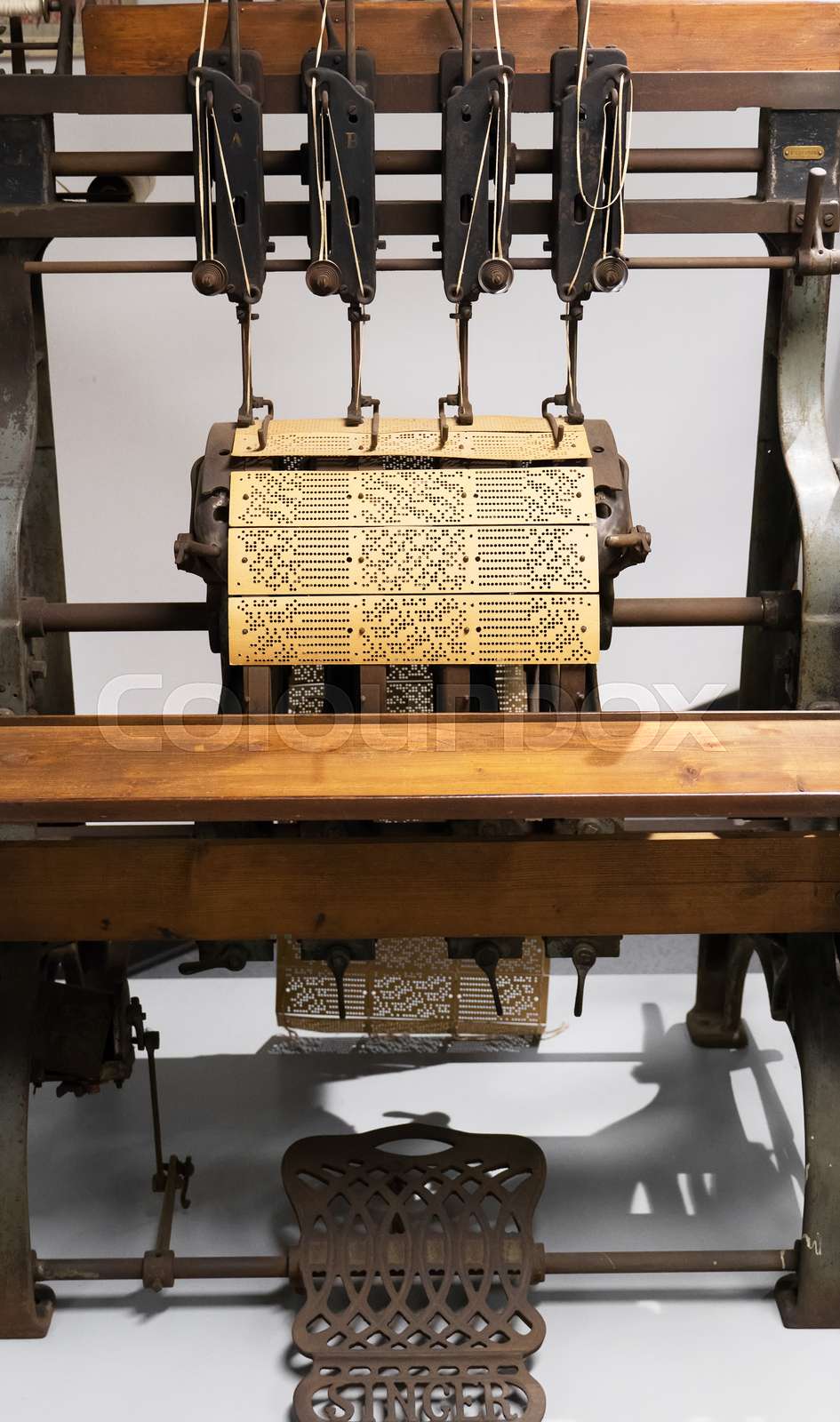 Binding machine. Used to sew together perforated cards for the Jacquard ...