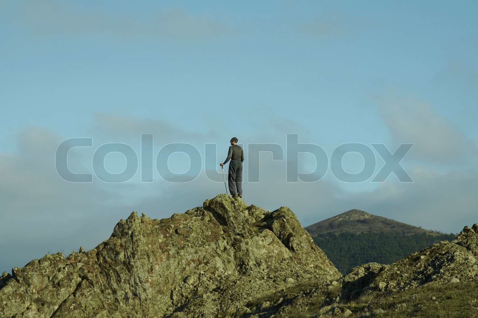 Male on the rock | Stock image | Colourbox