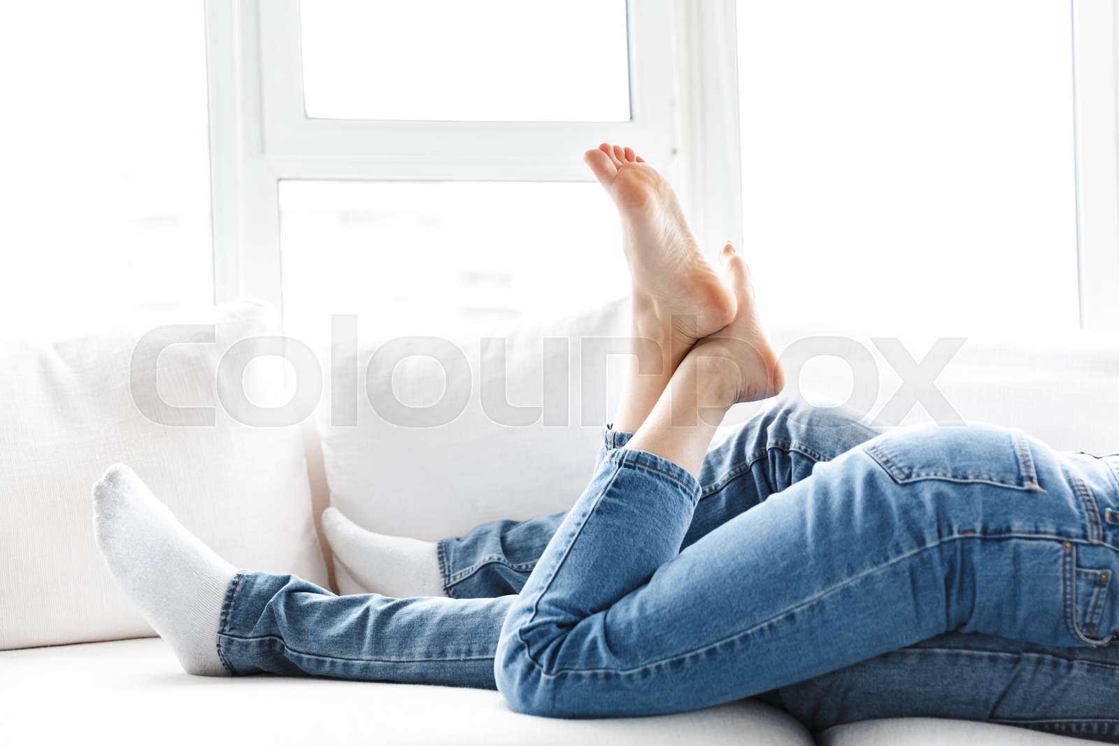 Cropped portrait of male and female legs, young couple hugging together ...