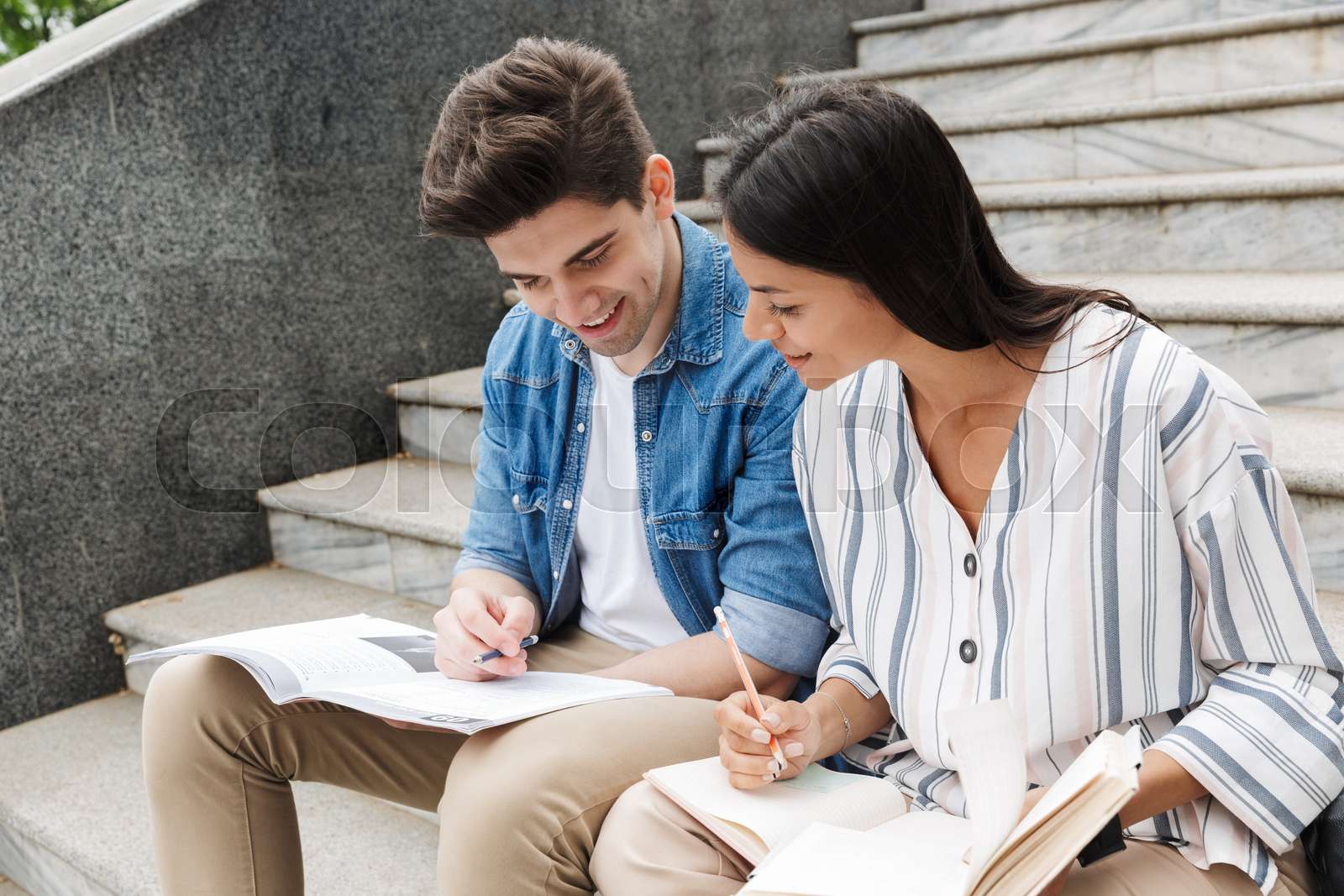 Amazing loving couple students colleagues outdoors outside on steps ...