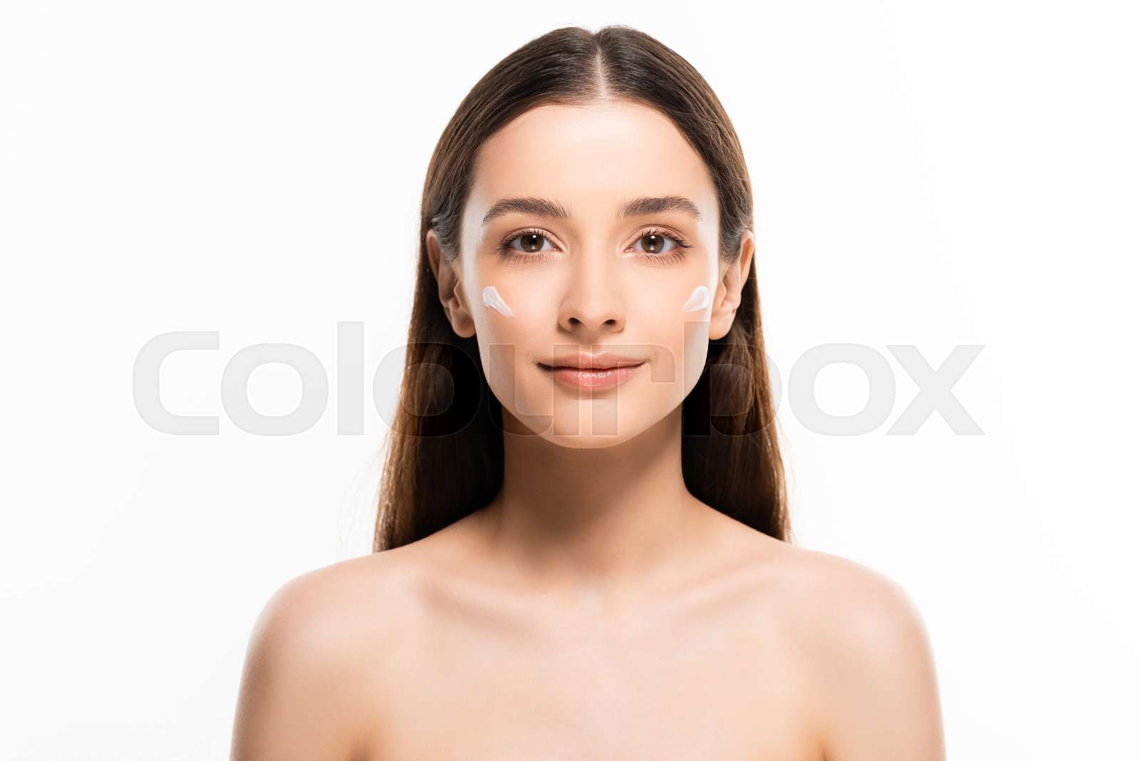 beautiful young naked woman with perfect skin and cosmetic cream on face isolated on white ...