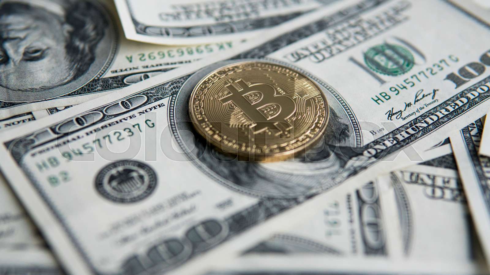 Golden Bitcoins On US Dollars Digital Currency Close up New Virtual Golden Bitcoins On US Dollars Digital Currency Close up New Virtual