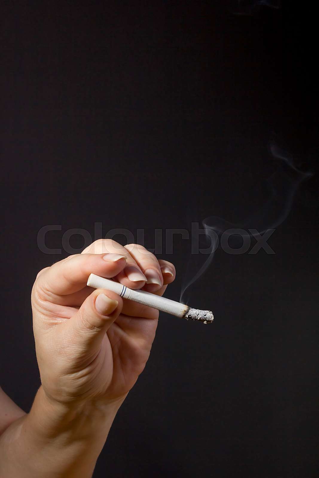 Hand with cigarette | Stock image | Colourbox