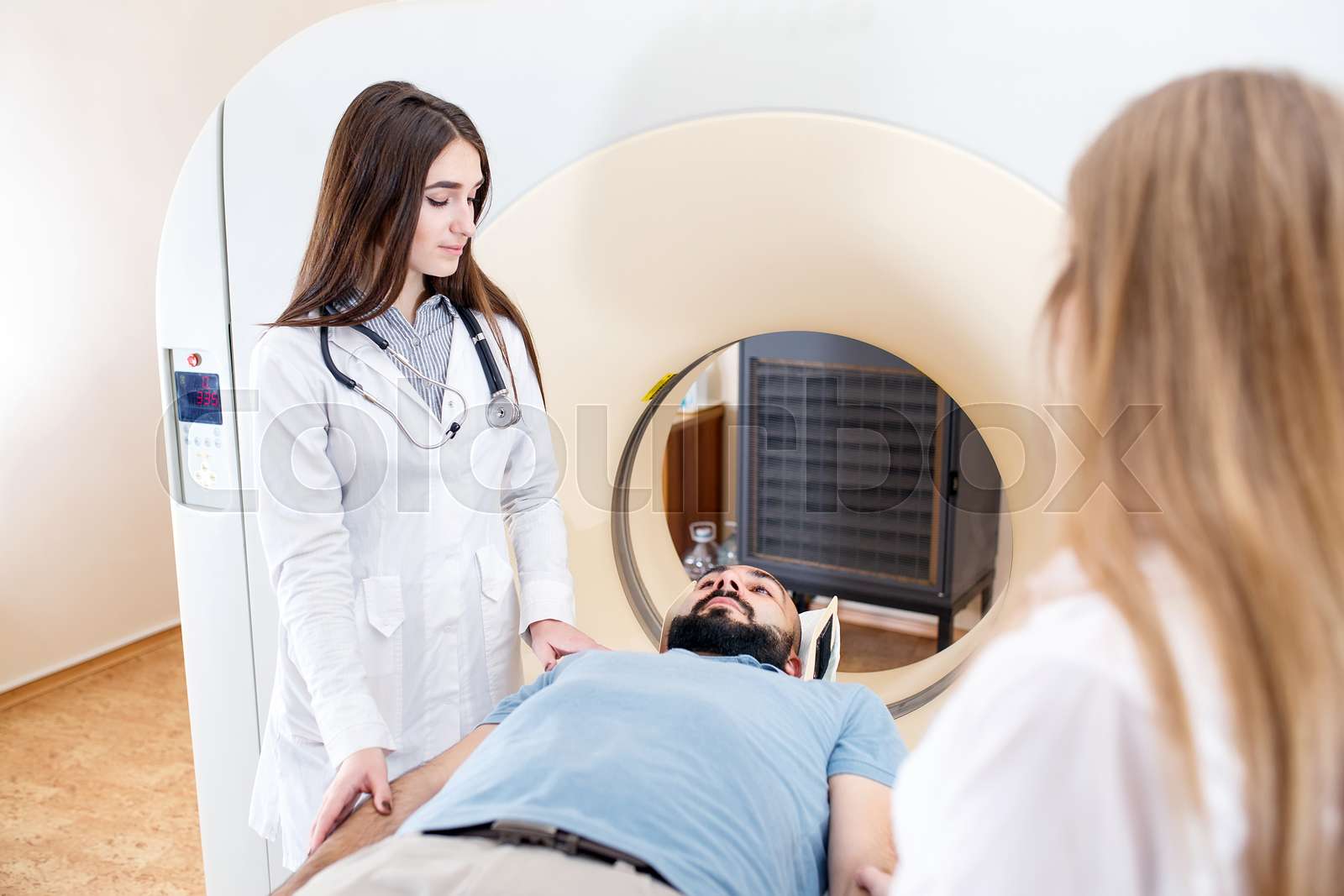 Happy patient undergoing mri scan at hospital. | Stock image | Colourbox