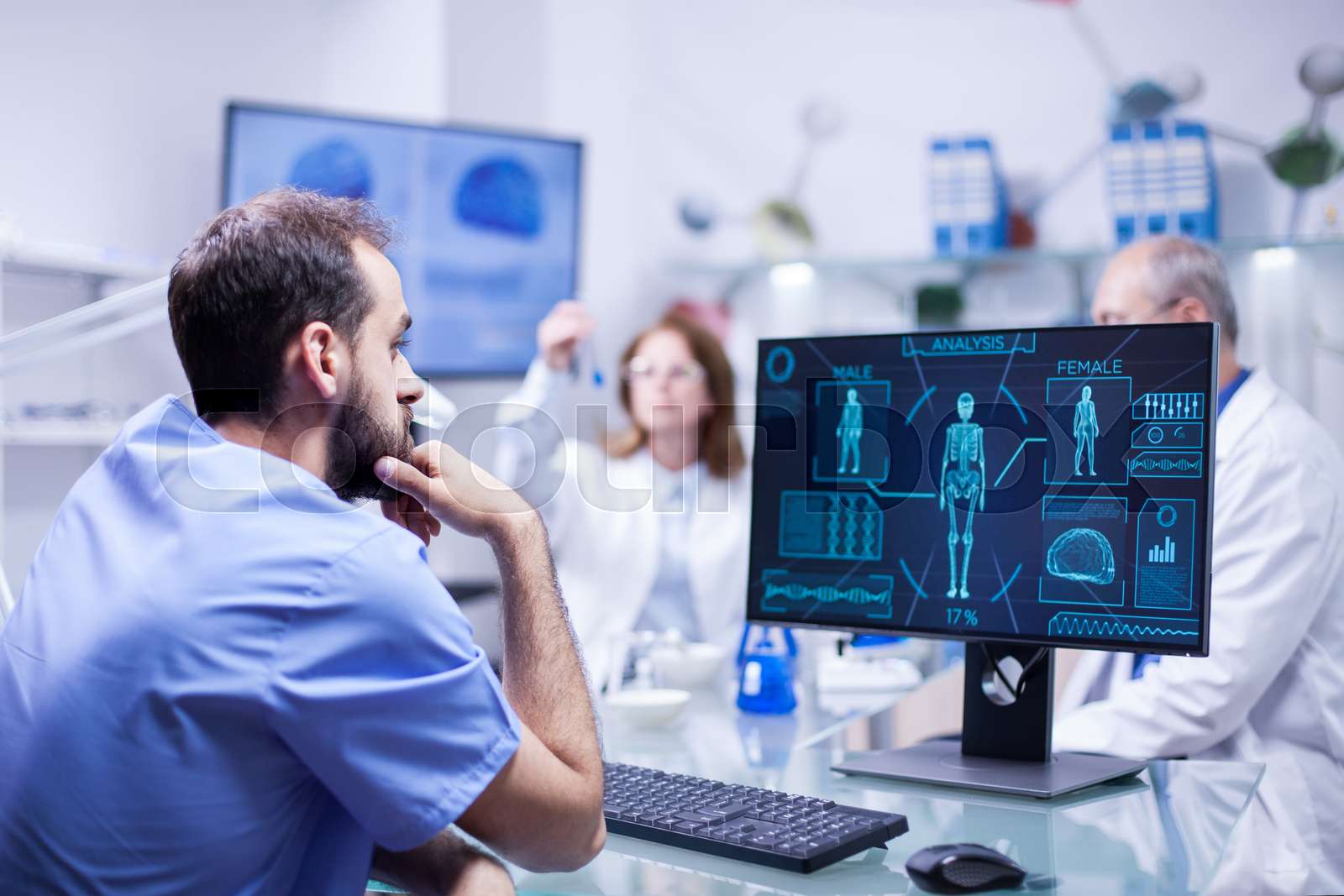 Young technician monitoring and evaluation male system in science ...