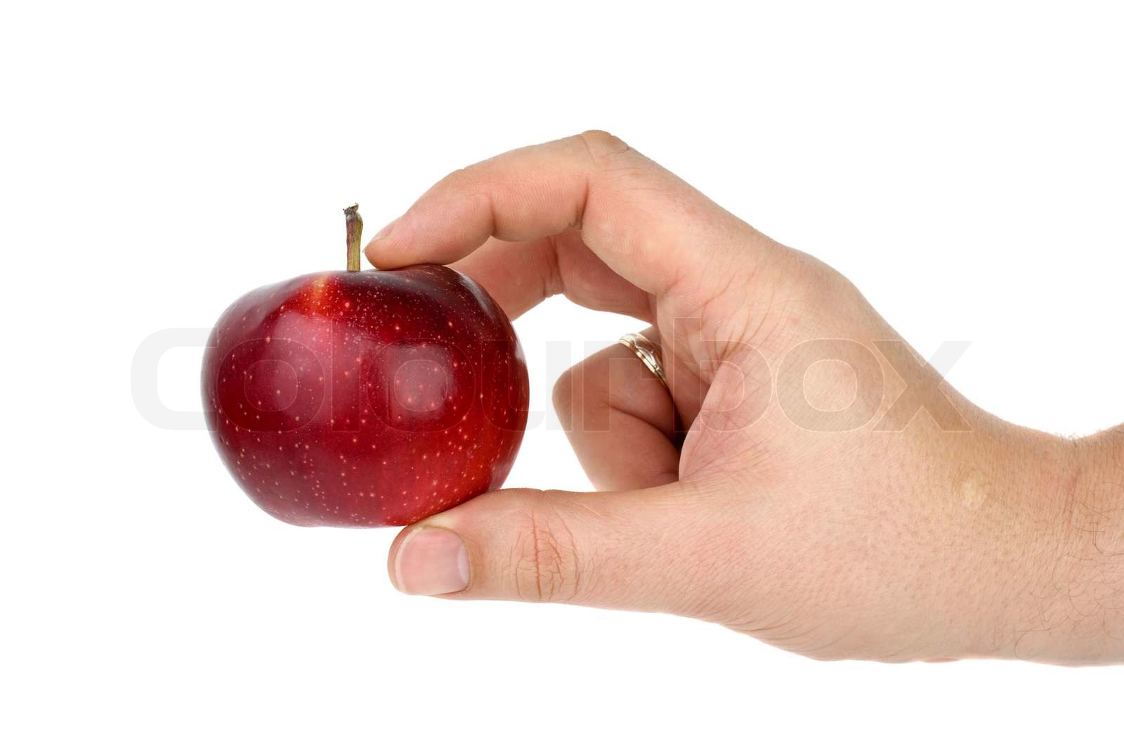 Hand taking red apple | Stock image | Colourbox