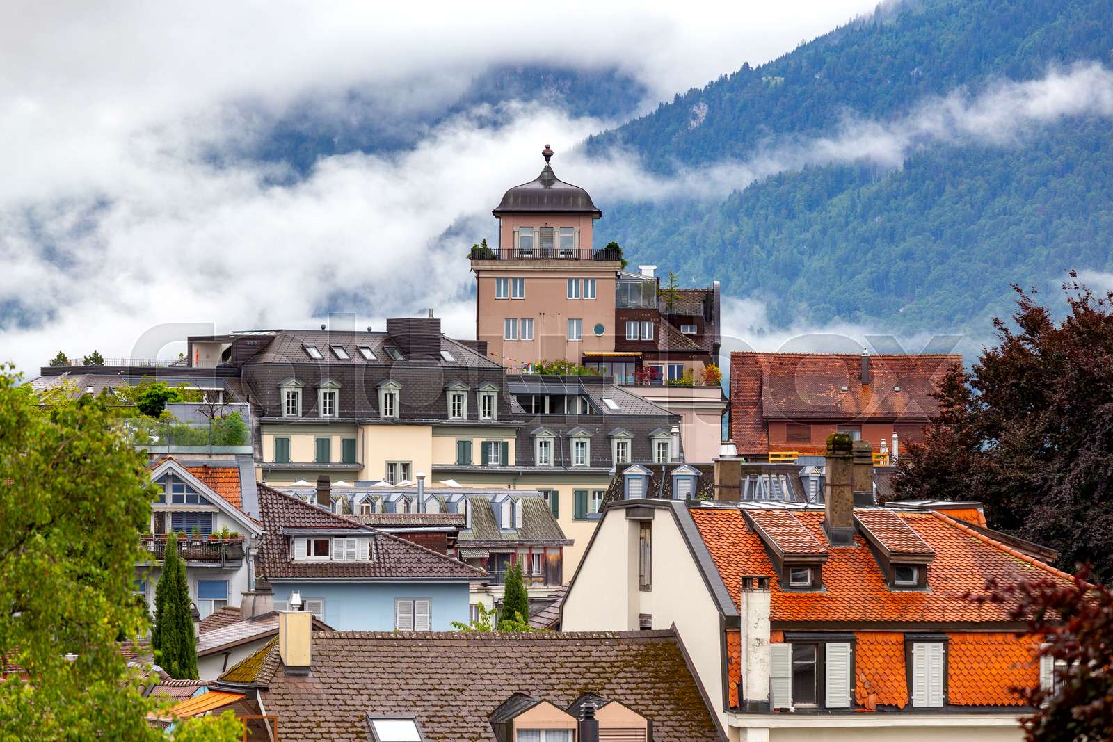 Interlaken. Aerial view of the city rooftops and mountains. | Stock ...