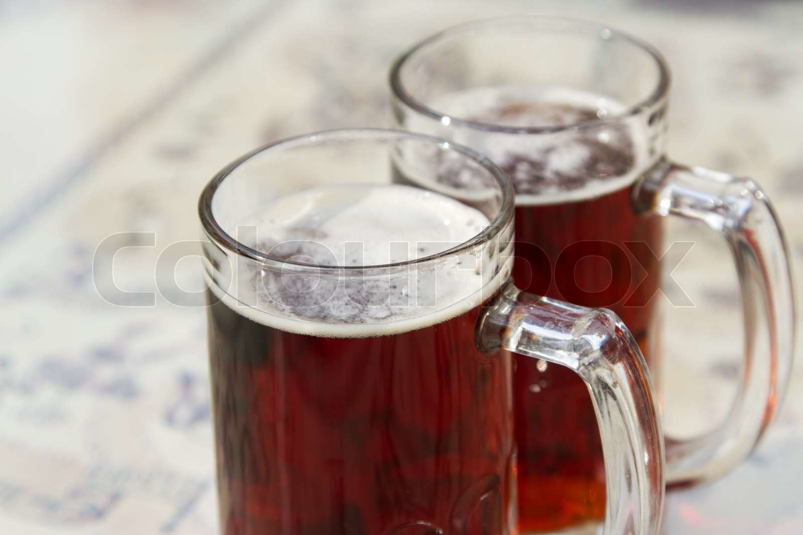 Two beer mugs closeup photo | Stock image | Colourbox