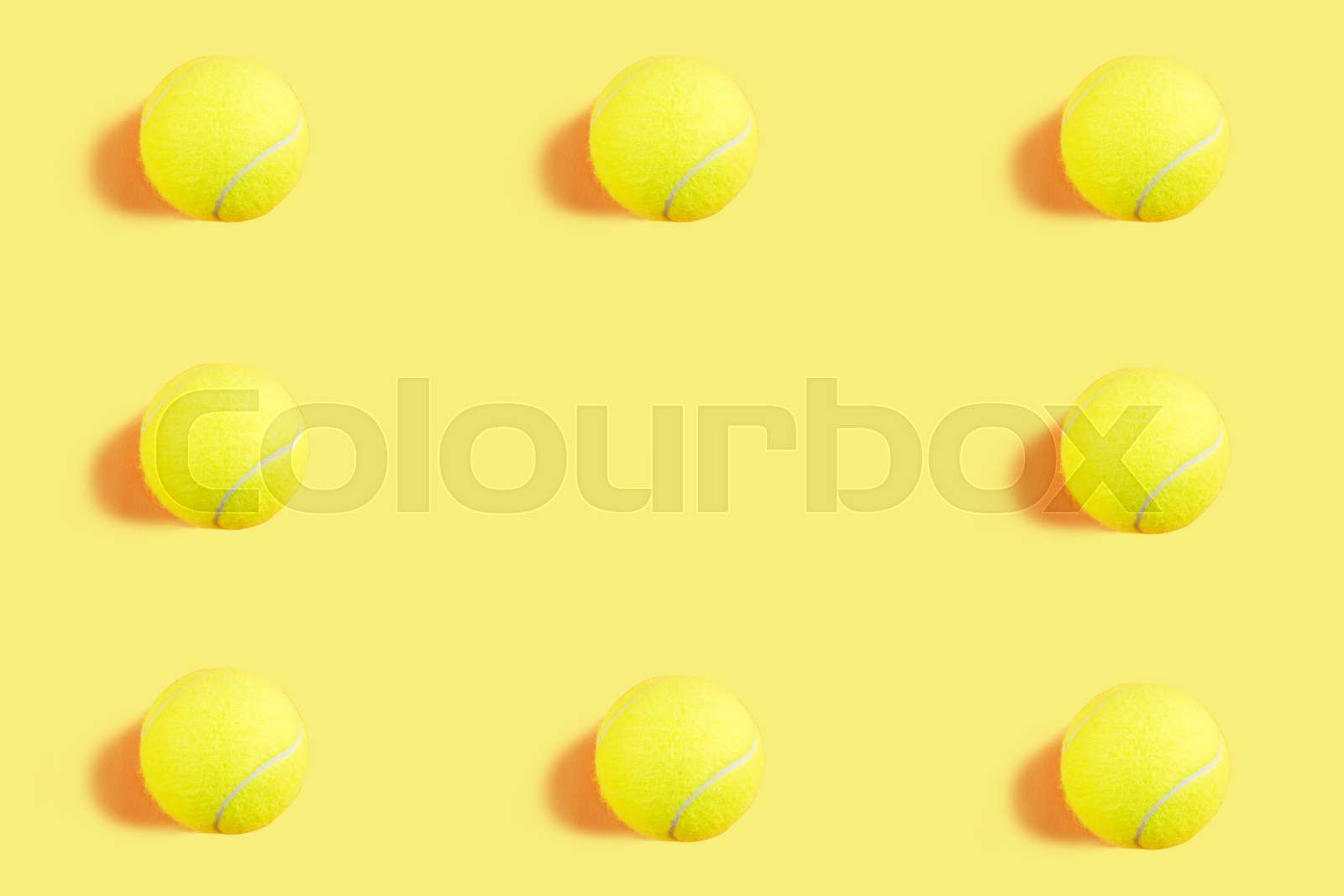 Tennis ball pattern on yellow. Frame | Stock image | Colourbox