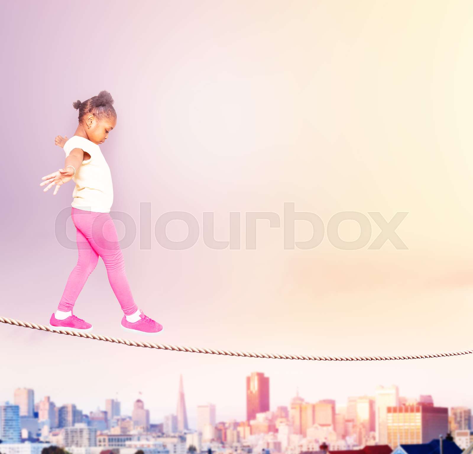 Beautiful black girl walking on the rope over city | Stock image ...