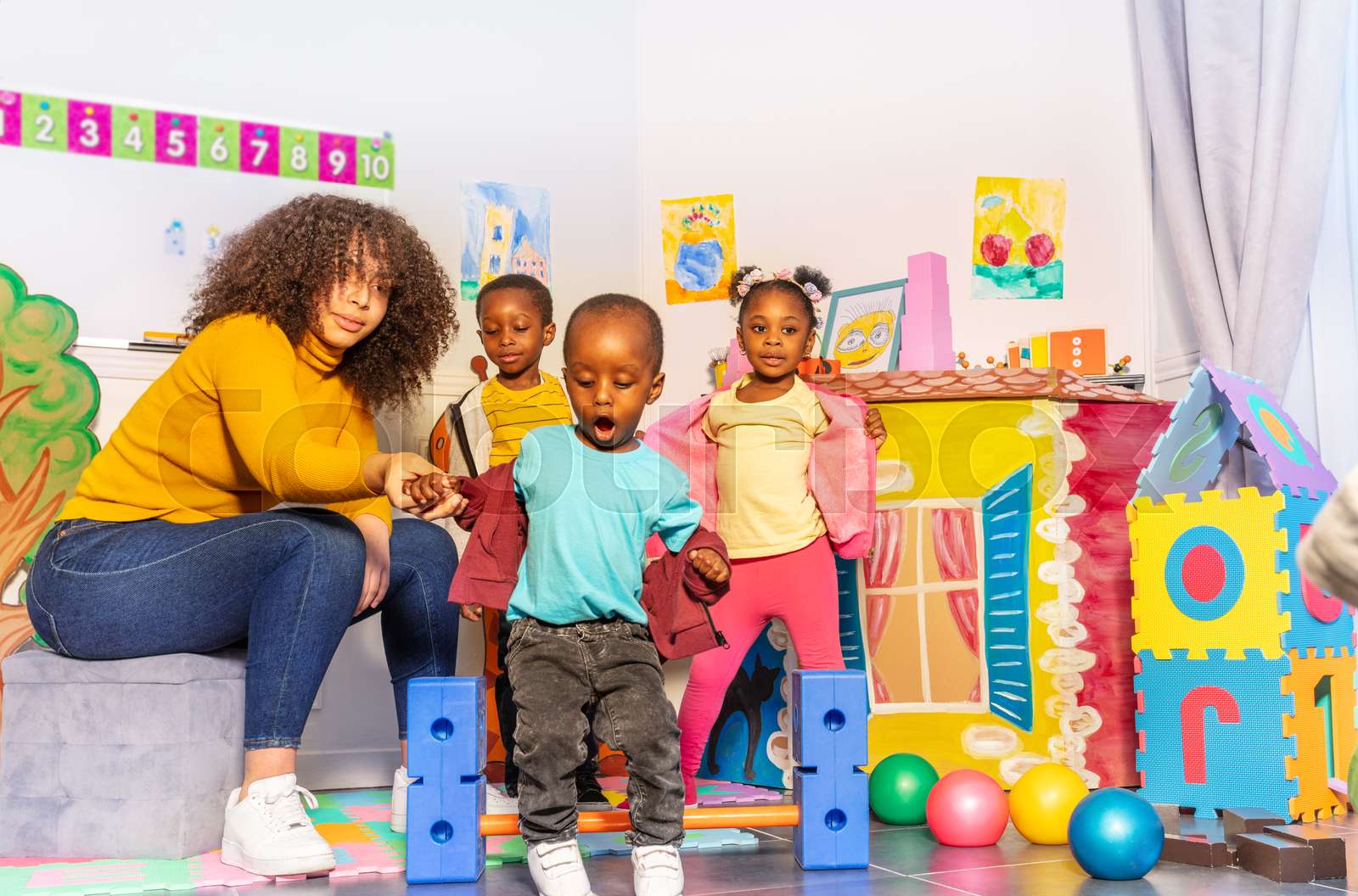 Early development games in kindergarten kids jump | Stock image | Colourbox