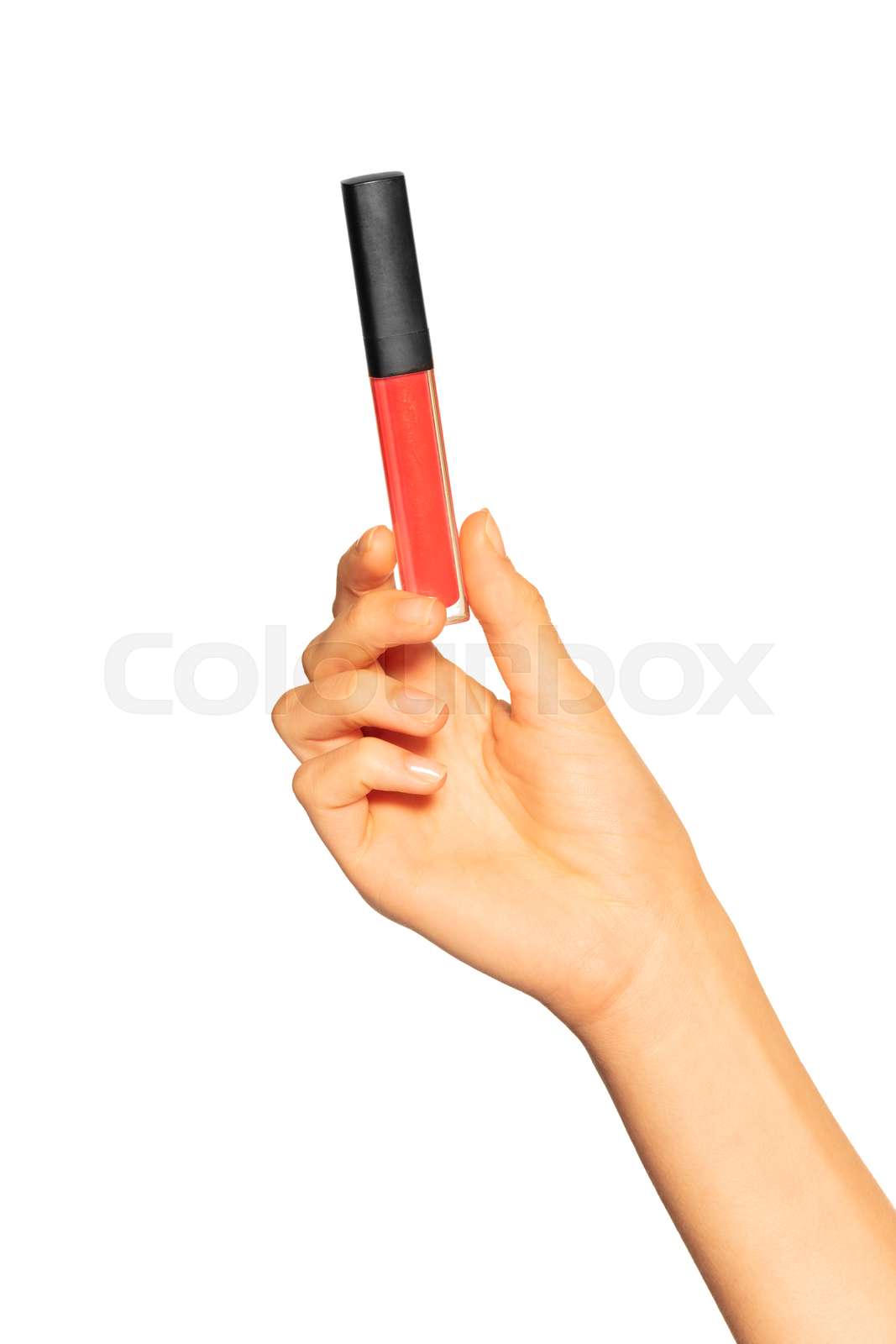Female hand holding tube with liquid lipstick | Stock image | Colourbox