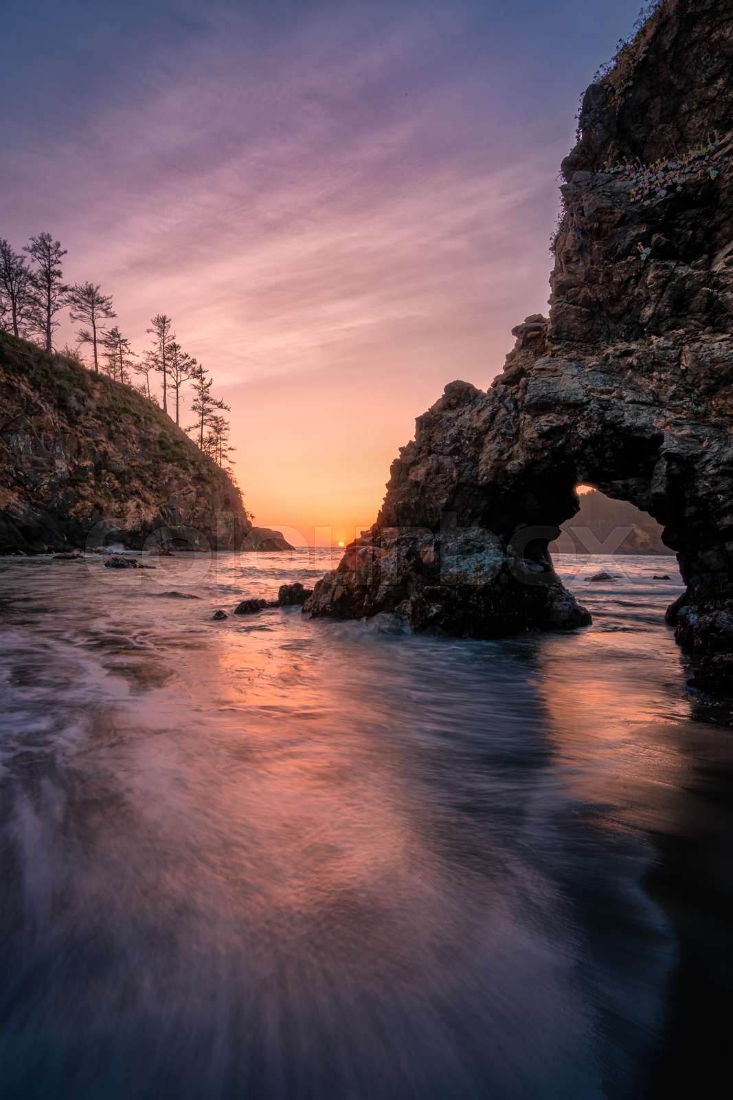 Trinidad State Beach, California at Sunset with Rock Arch | Stock image ...