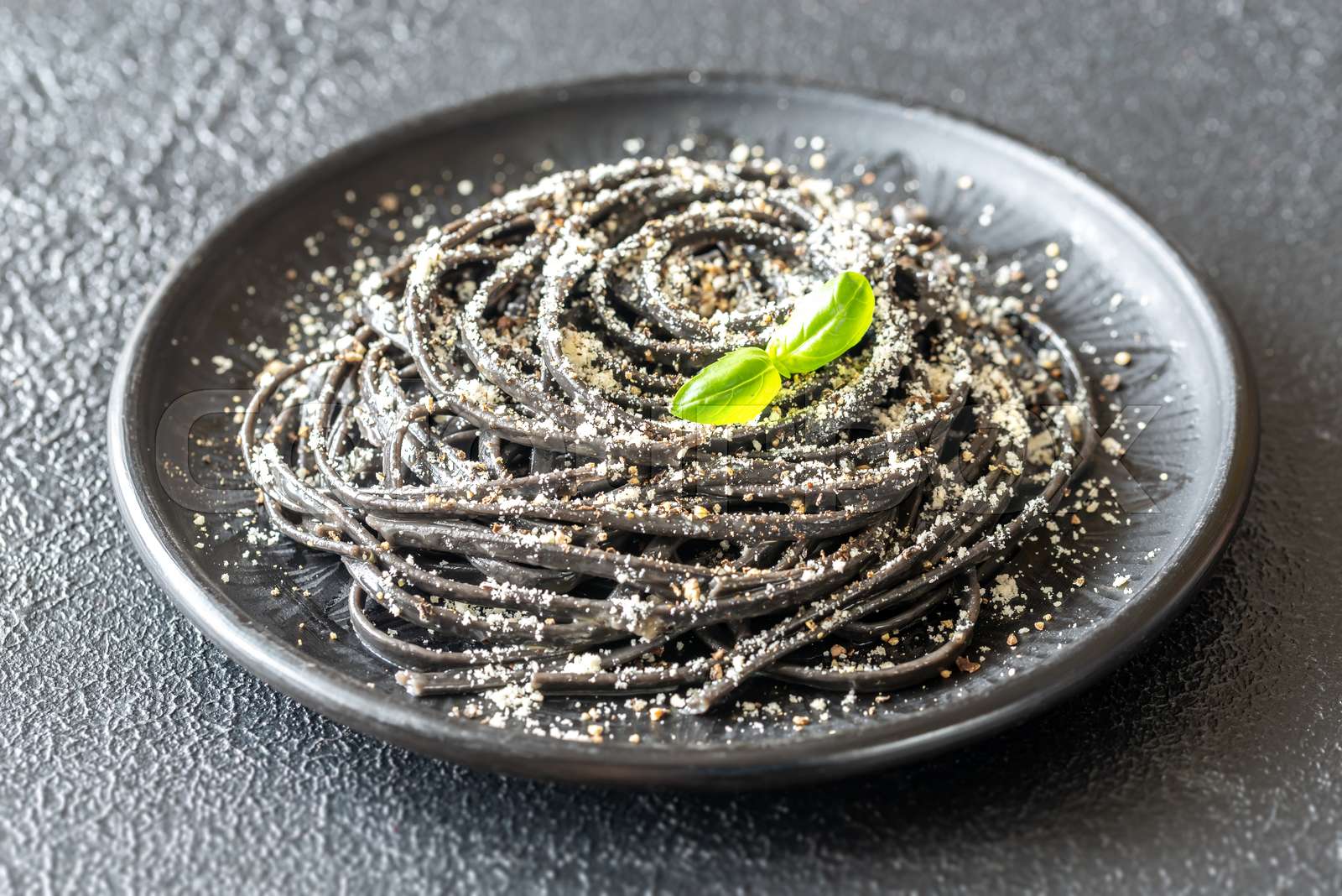 Portion of black Cacio e pepe pasta | Stock image | Colourbox