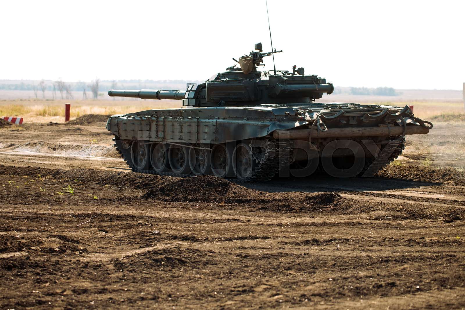 Armored Tank rides on off-road. Tank exercises in the countryside ...