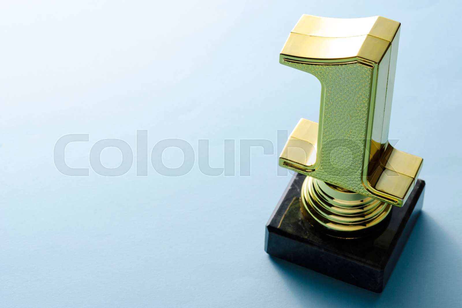First place gold metallic champions trophy | Stock image | Colourbox
