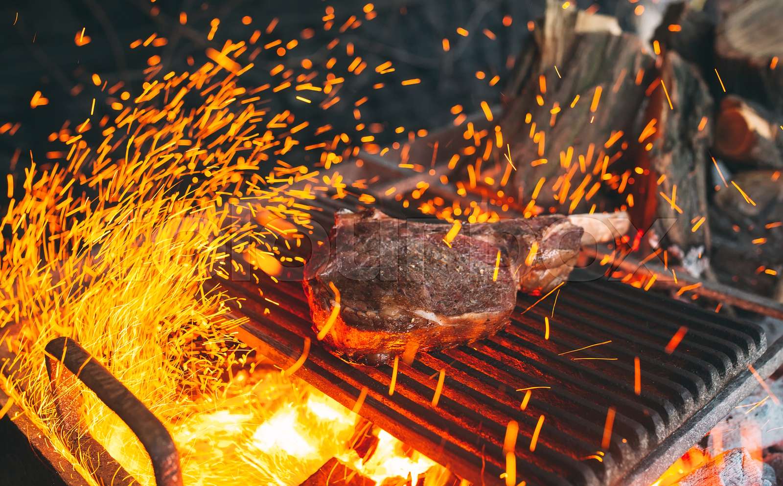 Beef steak is cooked on fire. Beef Rib BBQ . | Stock image | Colourbox