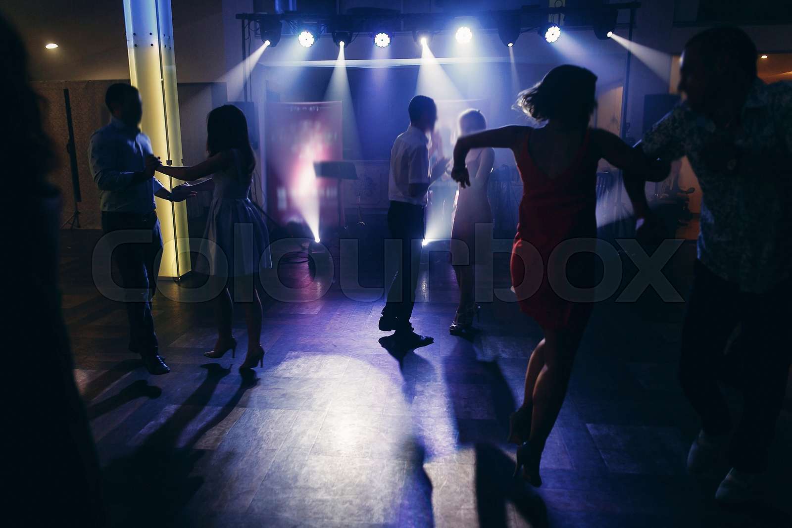 Fun dance party at nightclub after wedding reception, guests and ...