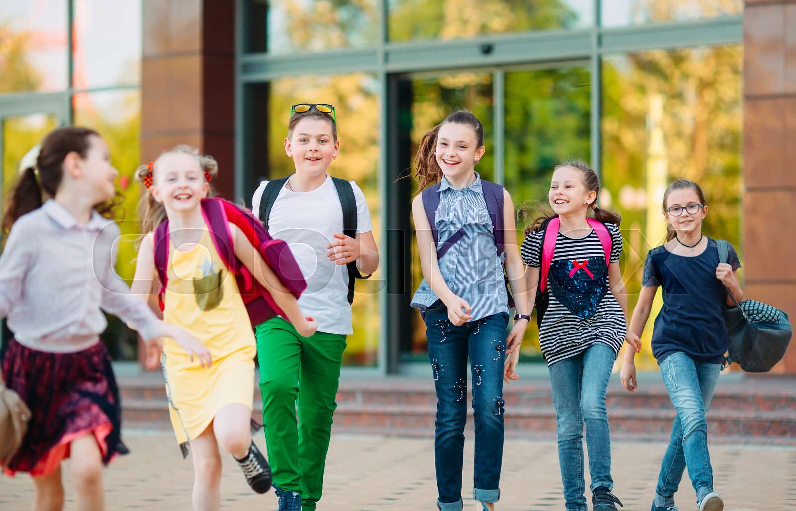 Group of kids going to school together. | Stock image | Colourbox