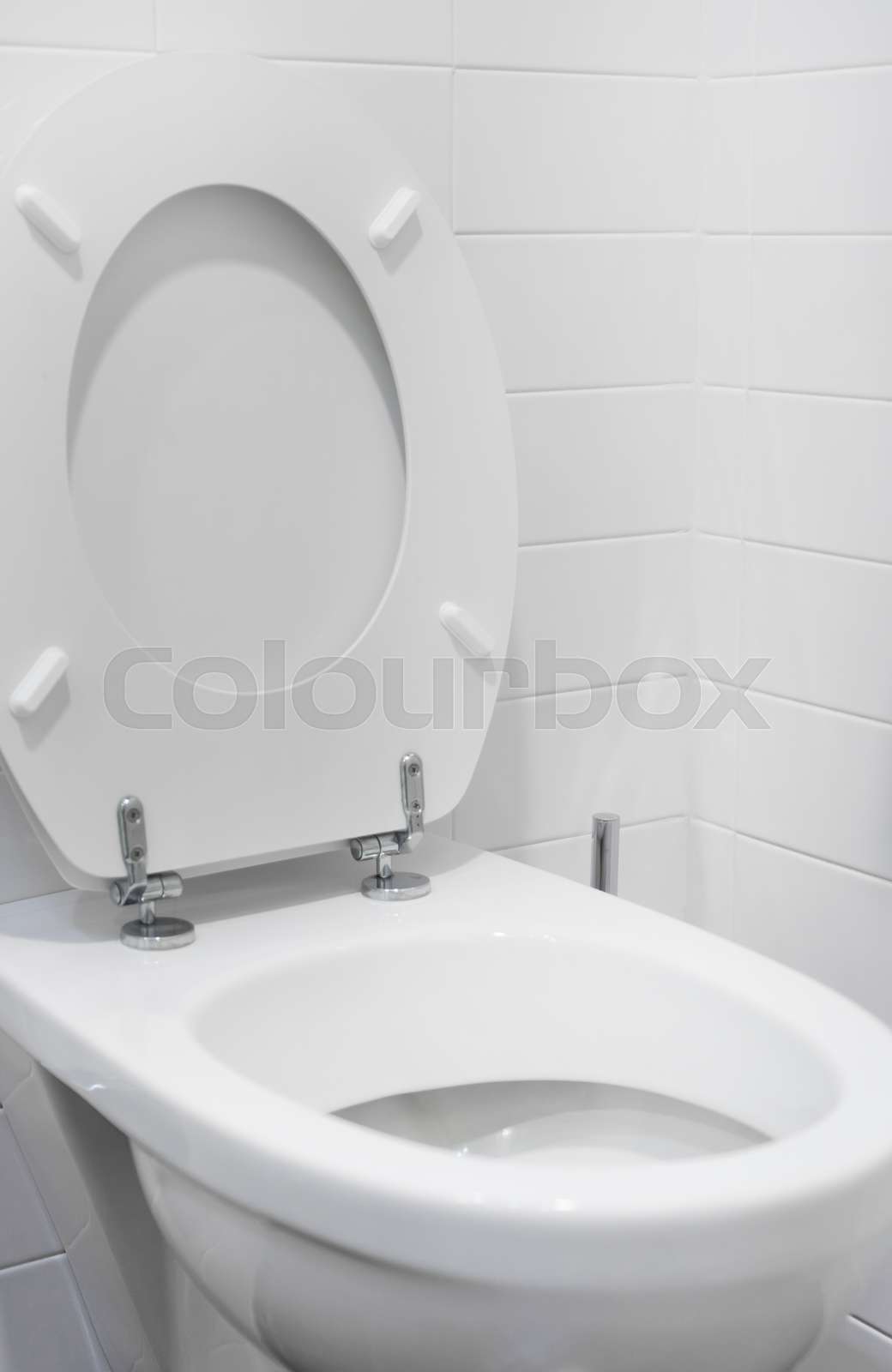 Toilet bowl view in water closet. | Stock image | Colourbox