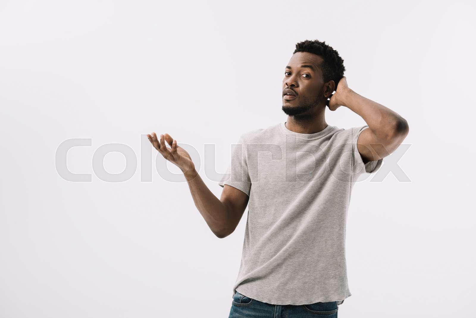 confused african american man gesturing isolated on white | Stock image ...