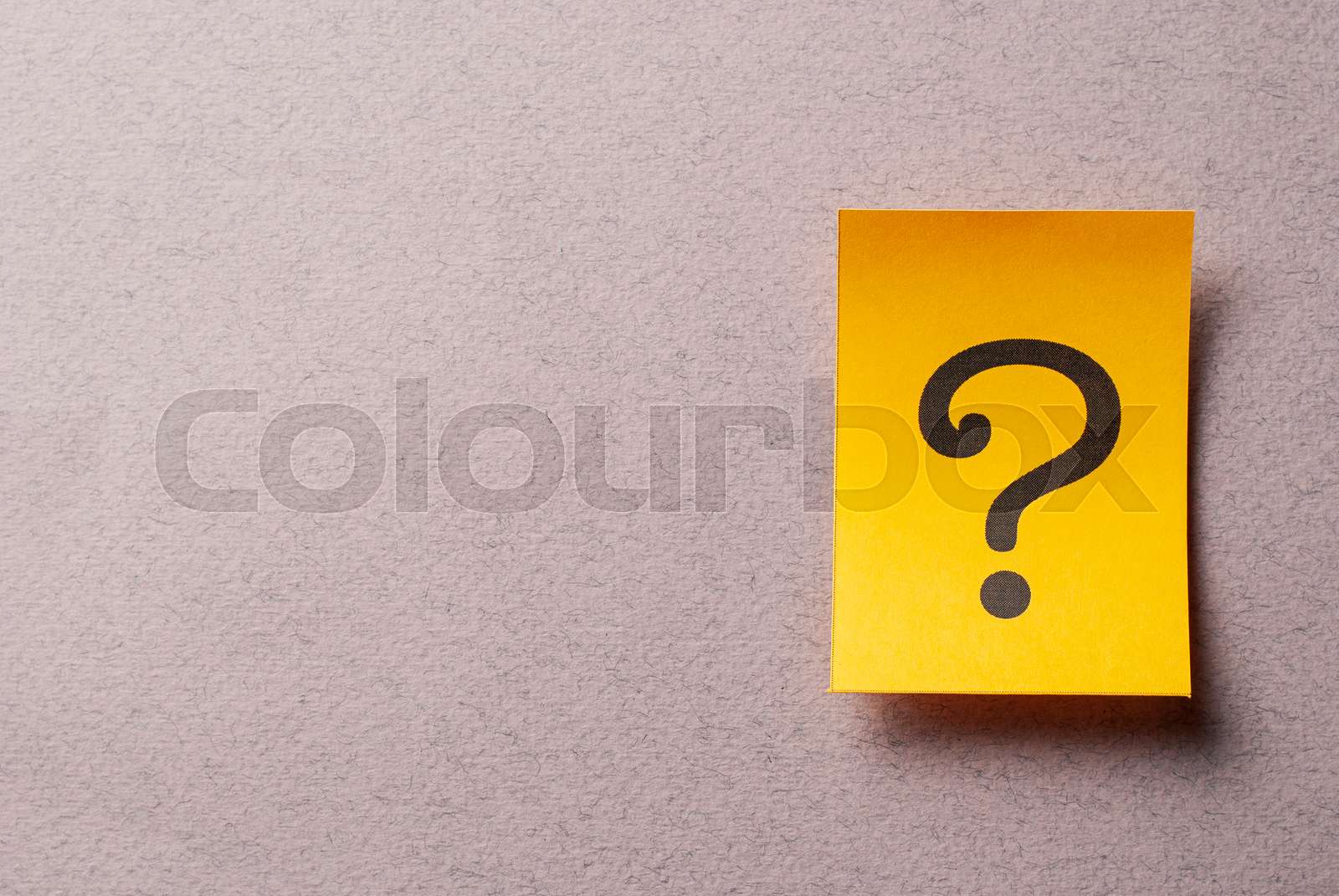 Colorful yellow card with printed question mark | Stock image | Colourbox