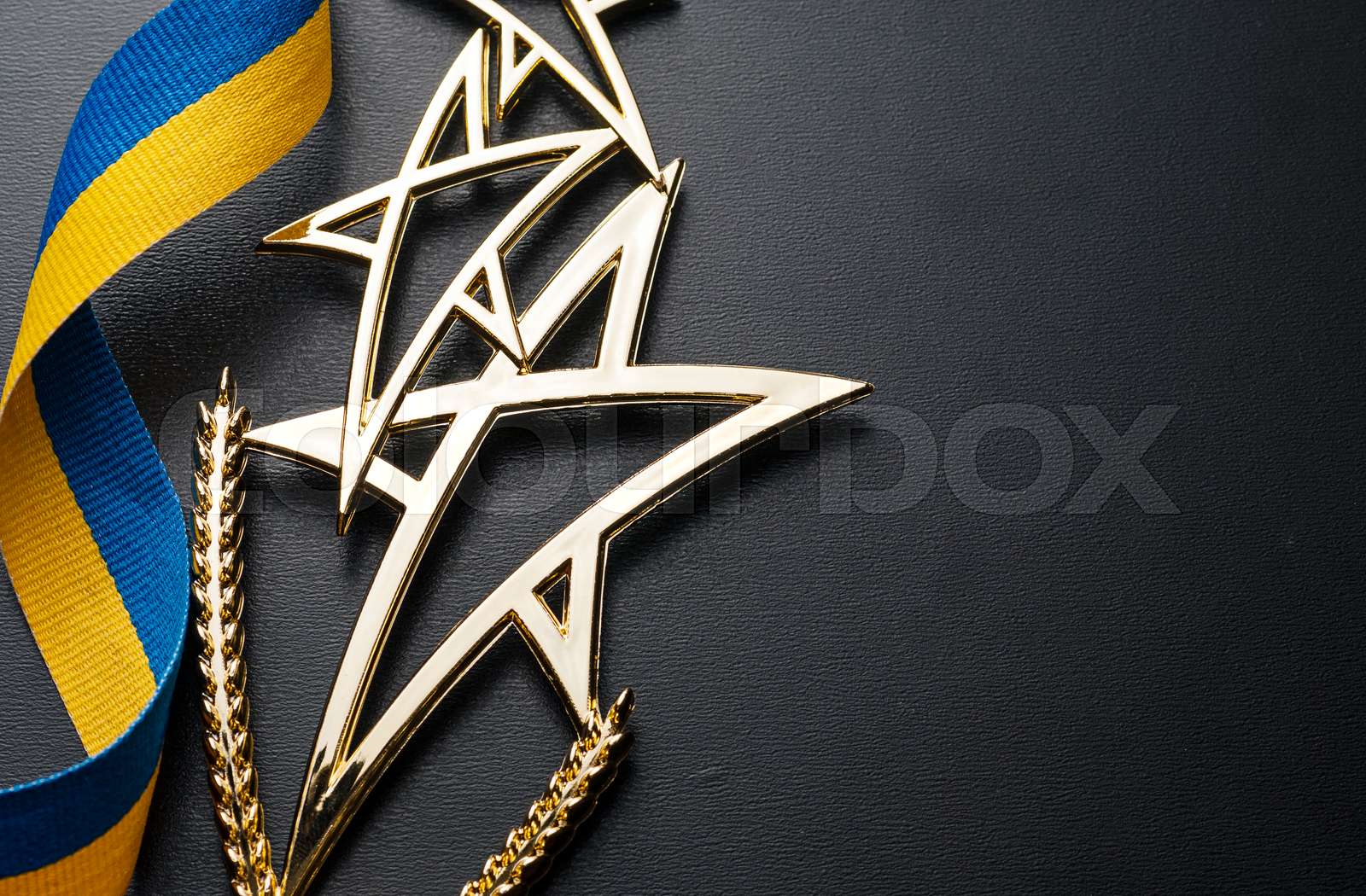 Gold shooting star trophy for a competition winner | Stock image ...