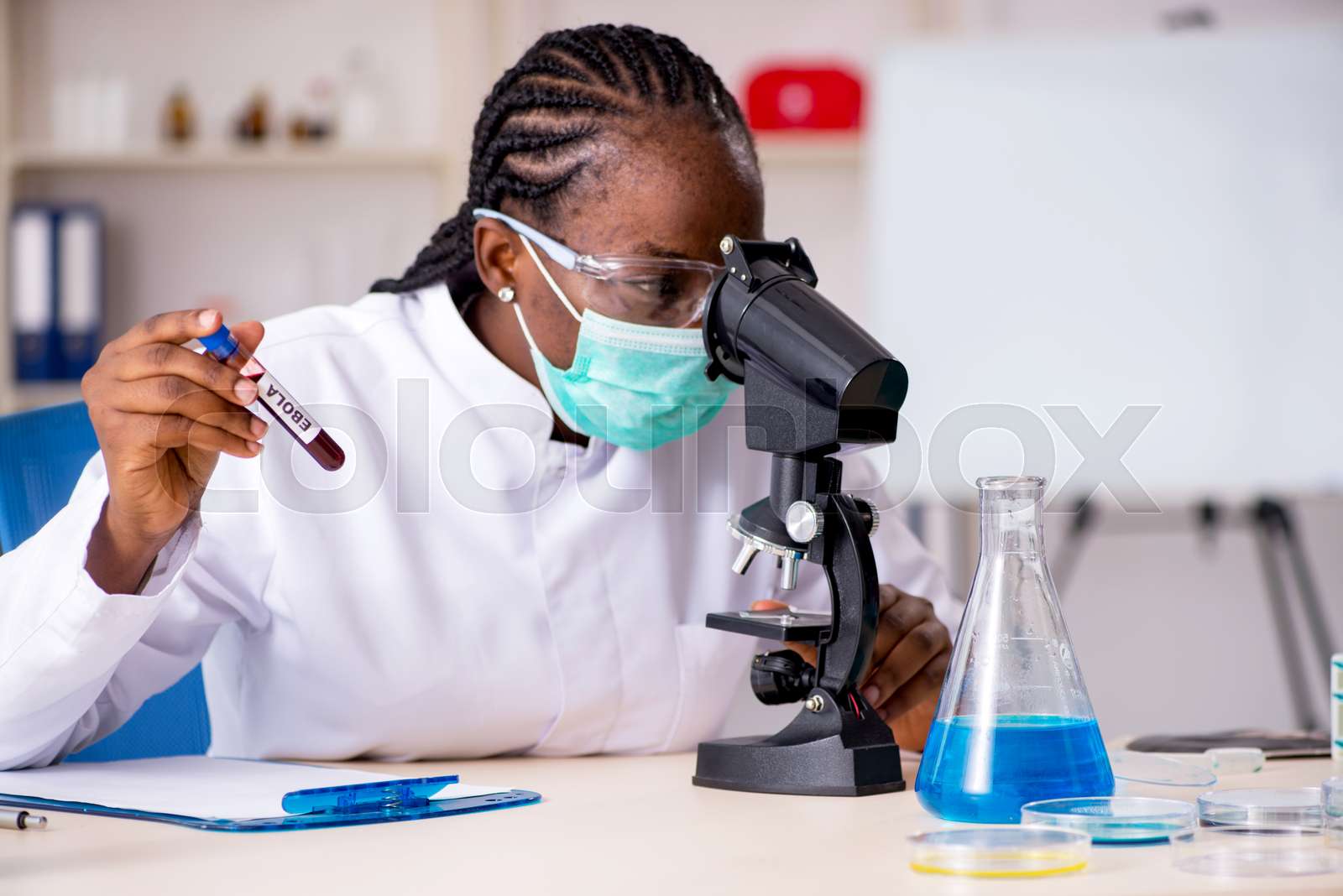Young black chemist working in the lab | Stock image | Colourbox