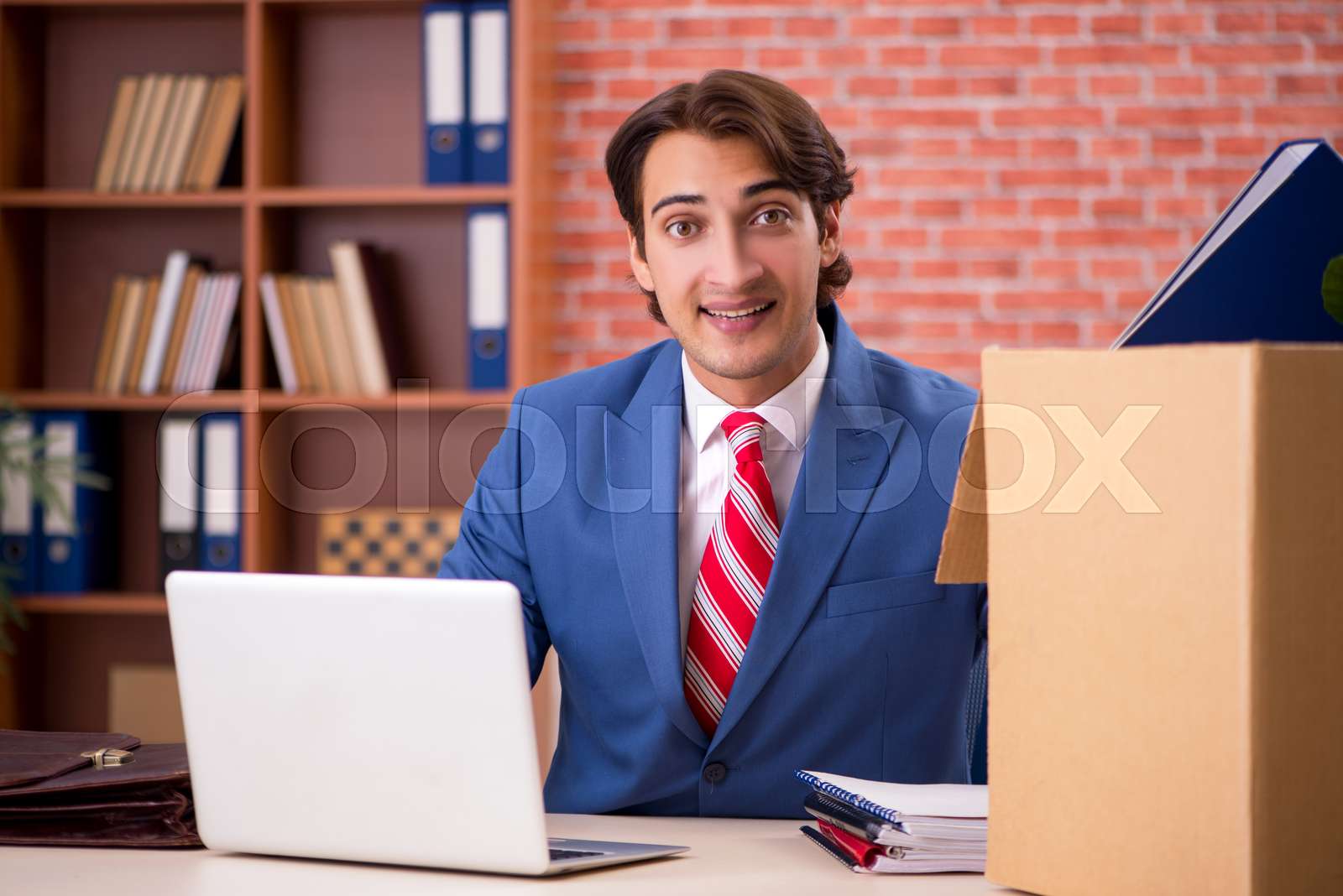 Successful employee getting new job position | Stock image | Colourbox
